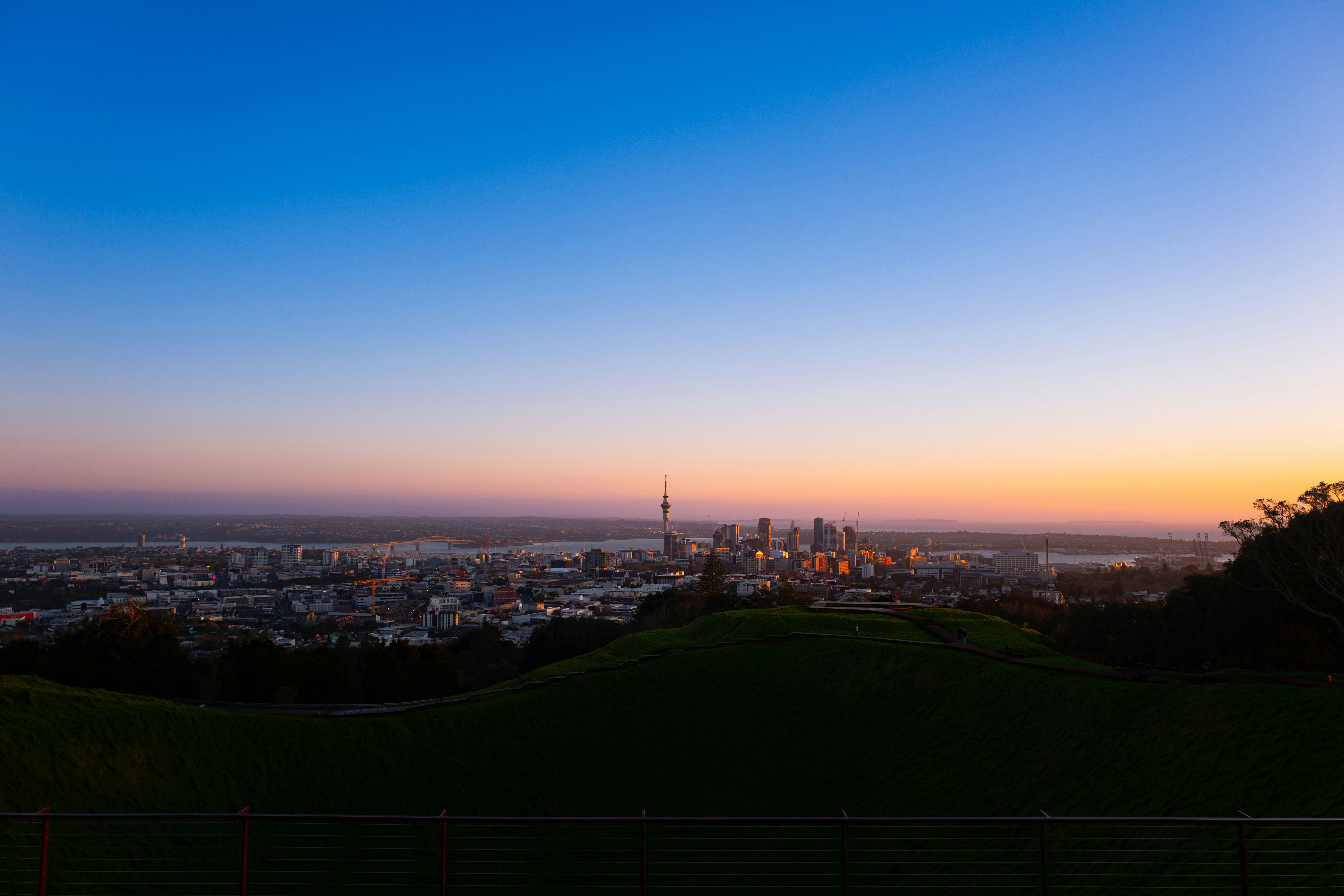 Dawn Over the City: Twilight Veil Along the Hills