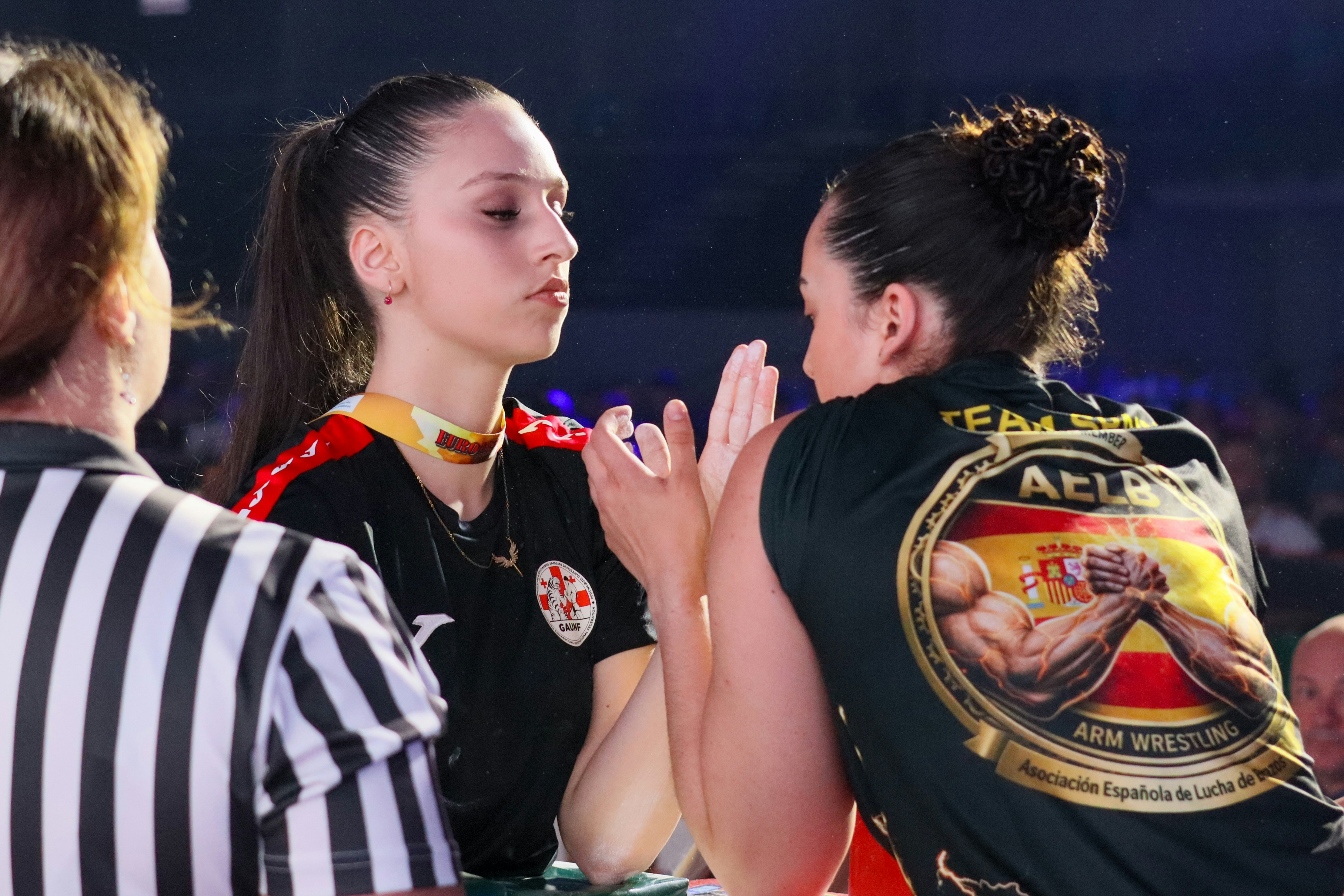 Female arm wrestlers face off before a competition.