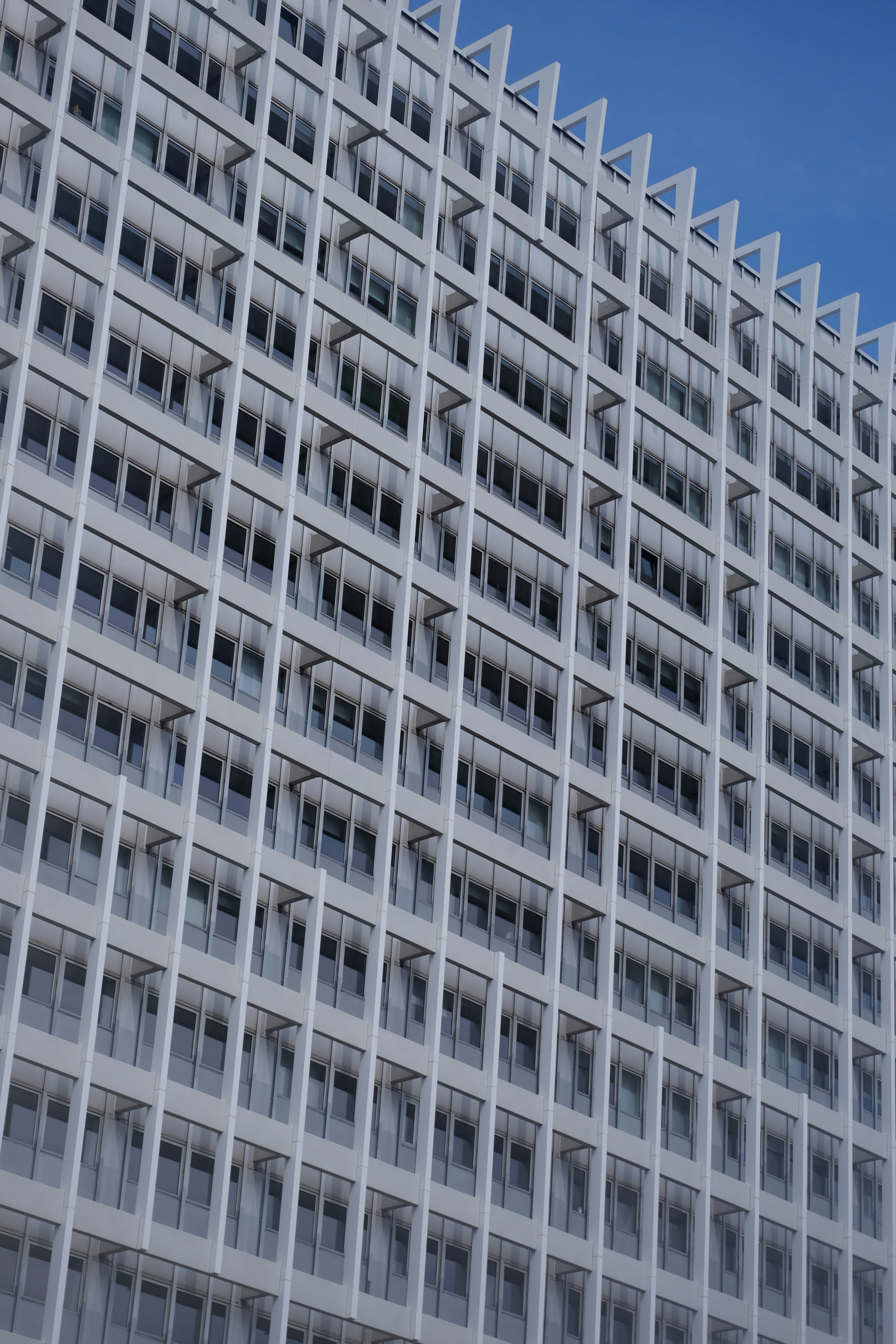 Grid of Windows under a Clear Sky