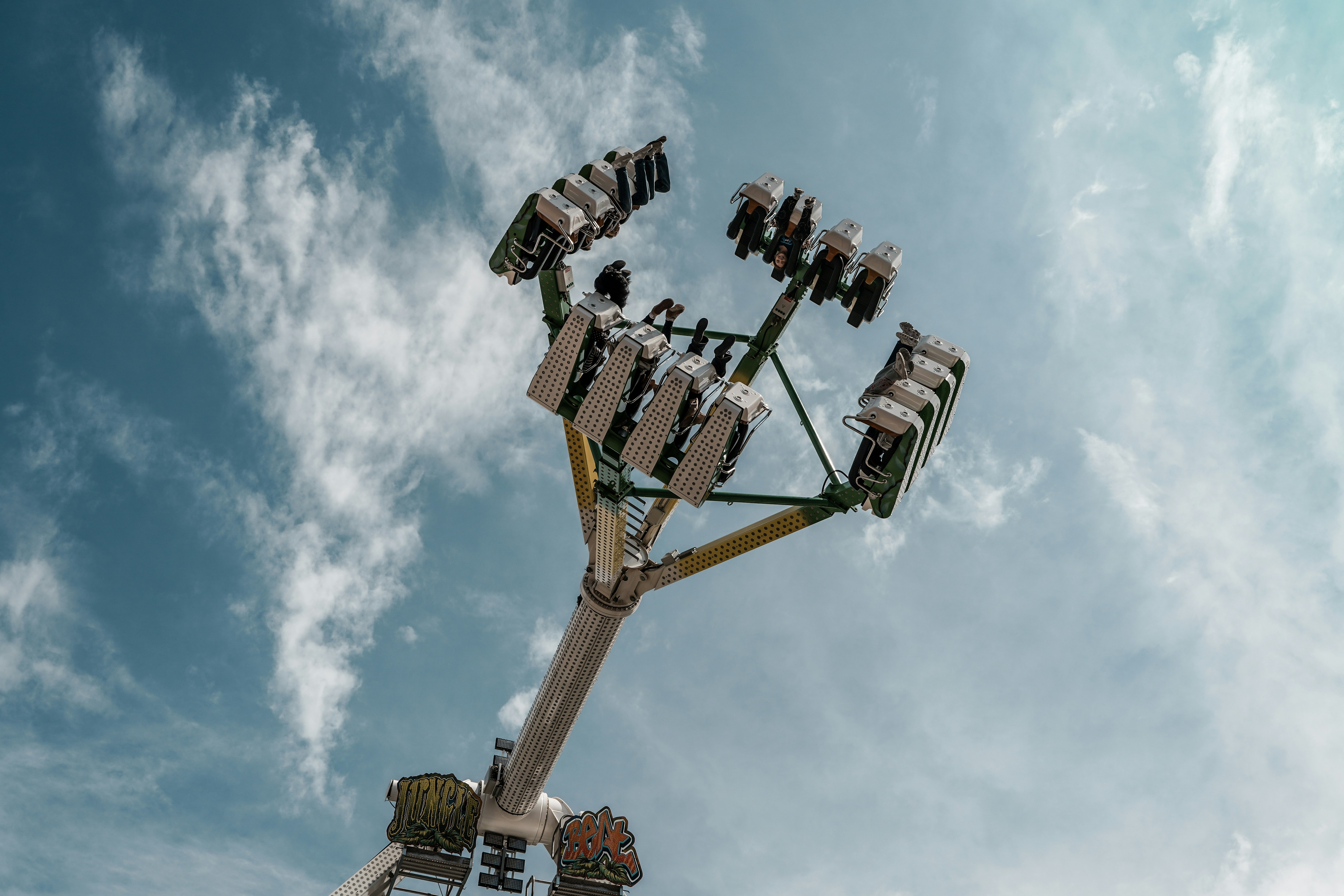 Skyward Carousel: A Tilted Moment Under a Bright Blue Sky