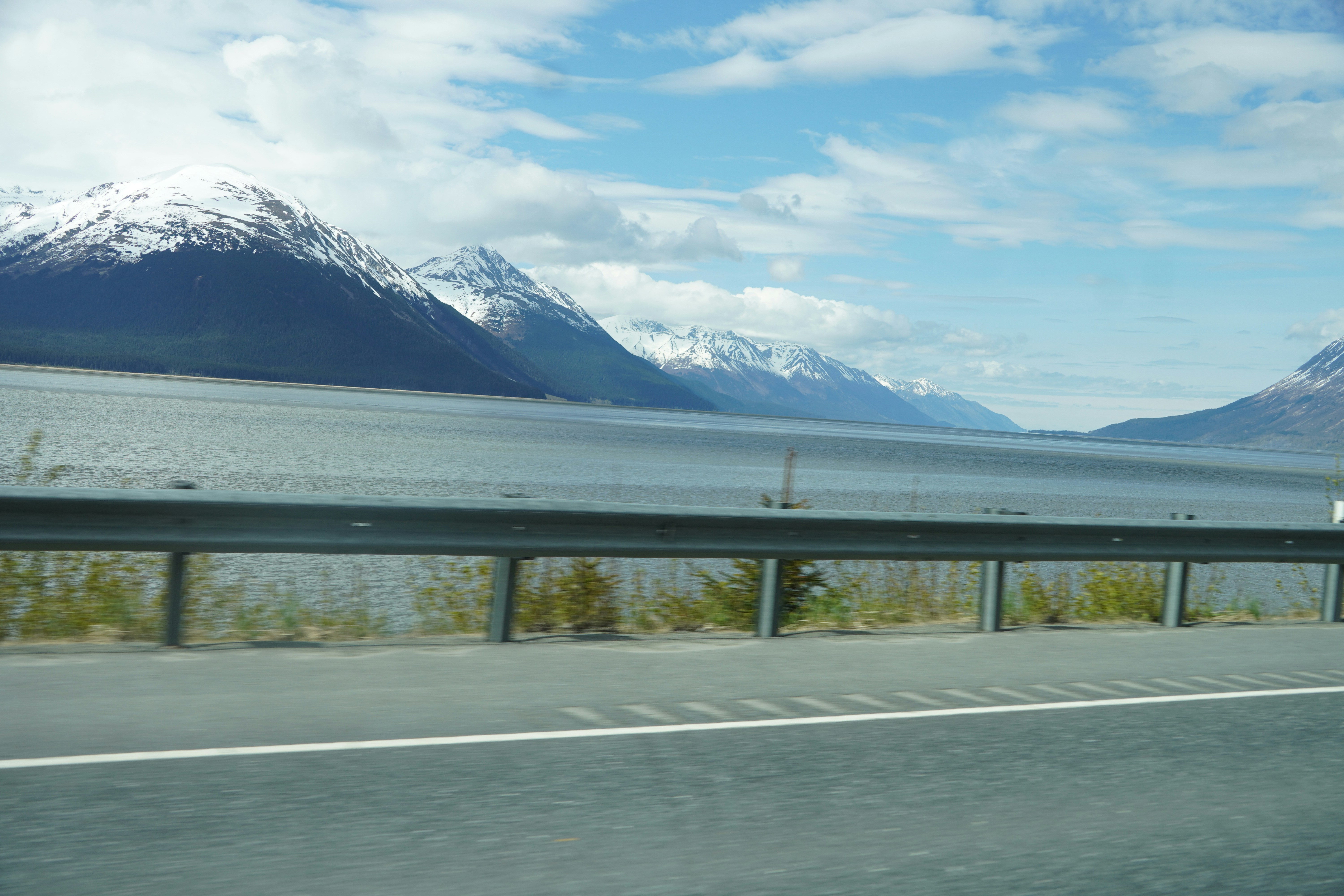 Snow-kissed Peaks Beyond the Highway