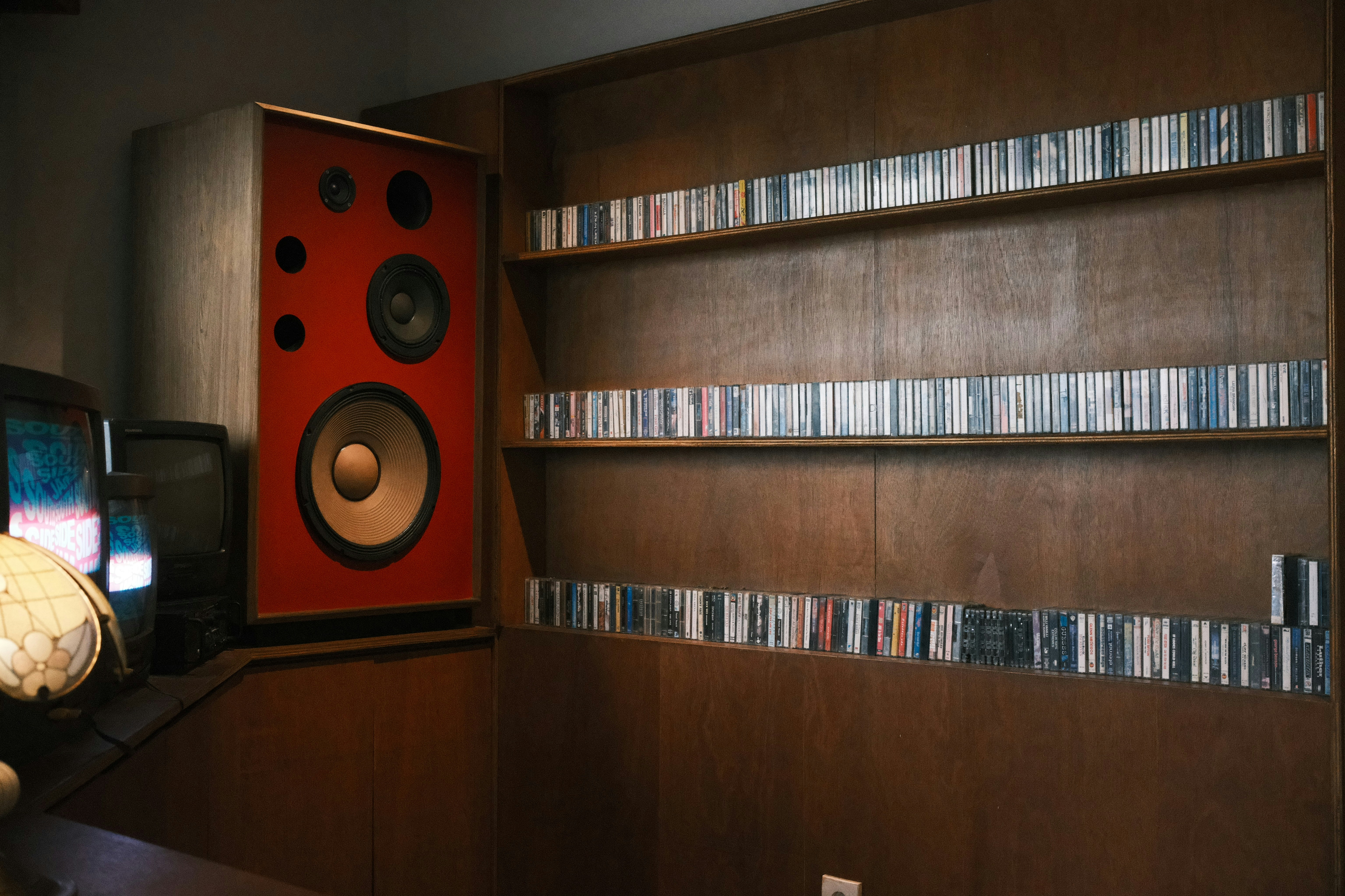 Retro Audio Corner: Red Speaker Anchors a Wall of Echoes
