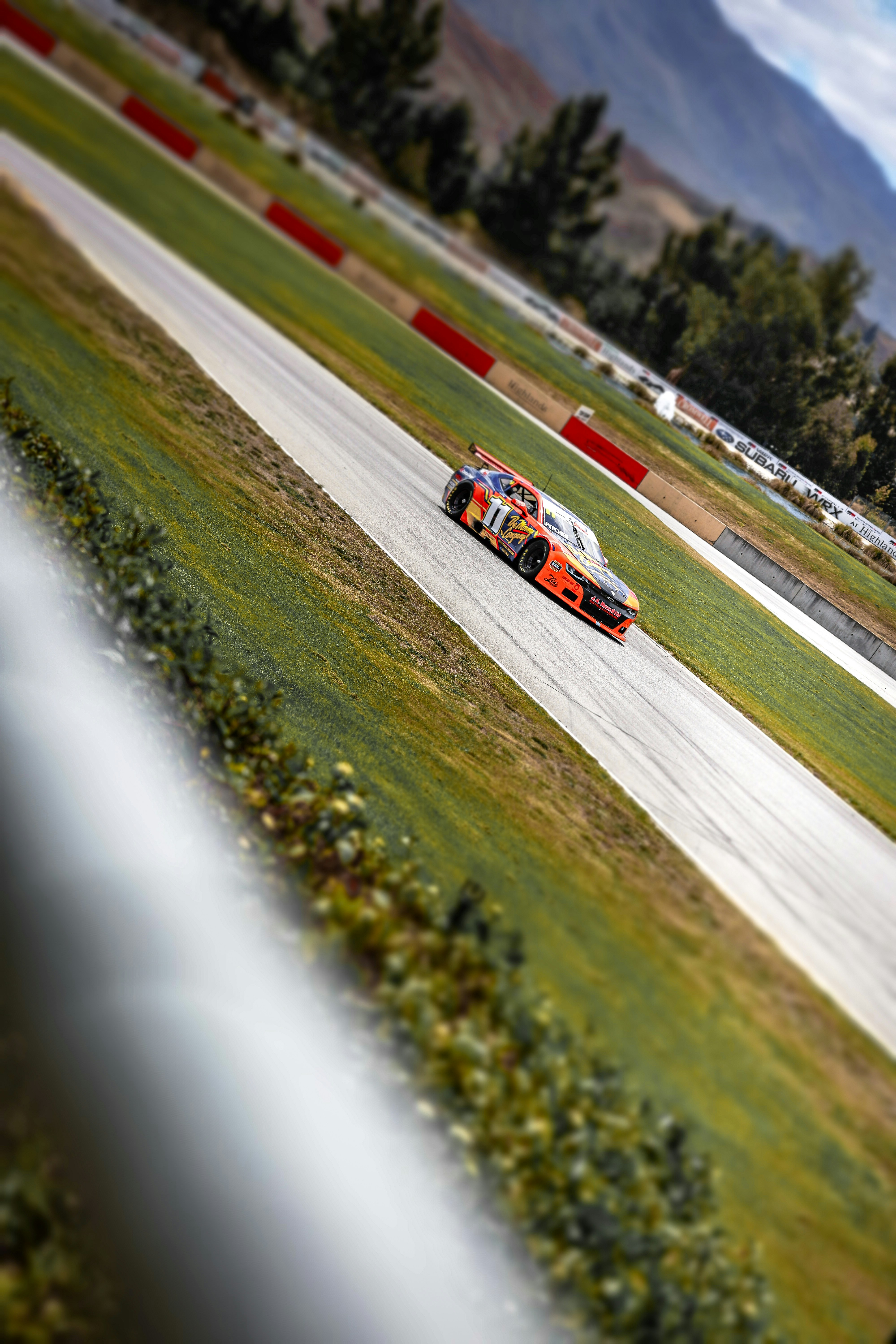 Red Lightning on Tarmac: A Racecar's Slipstream Moment