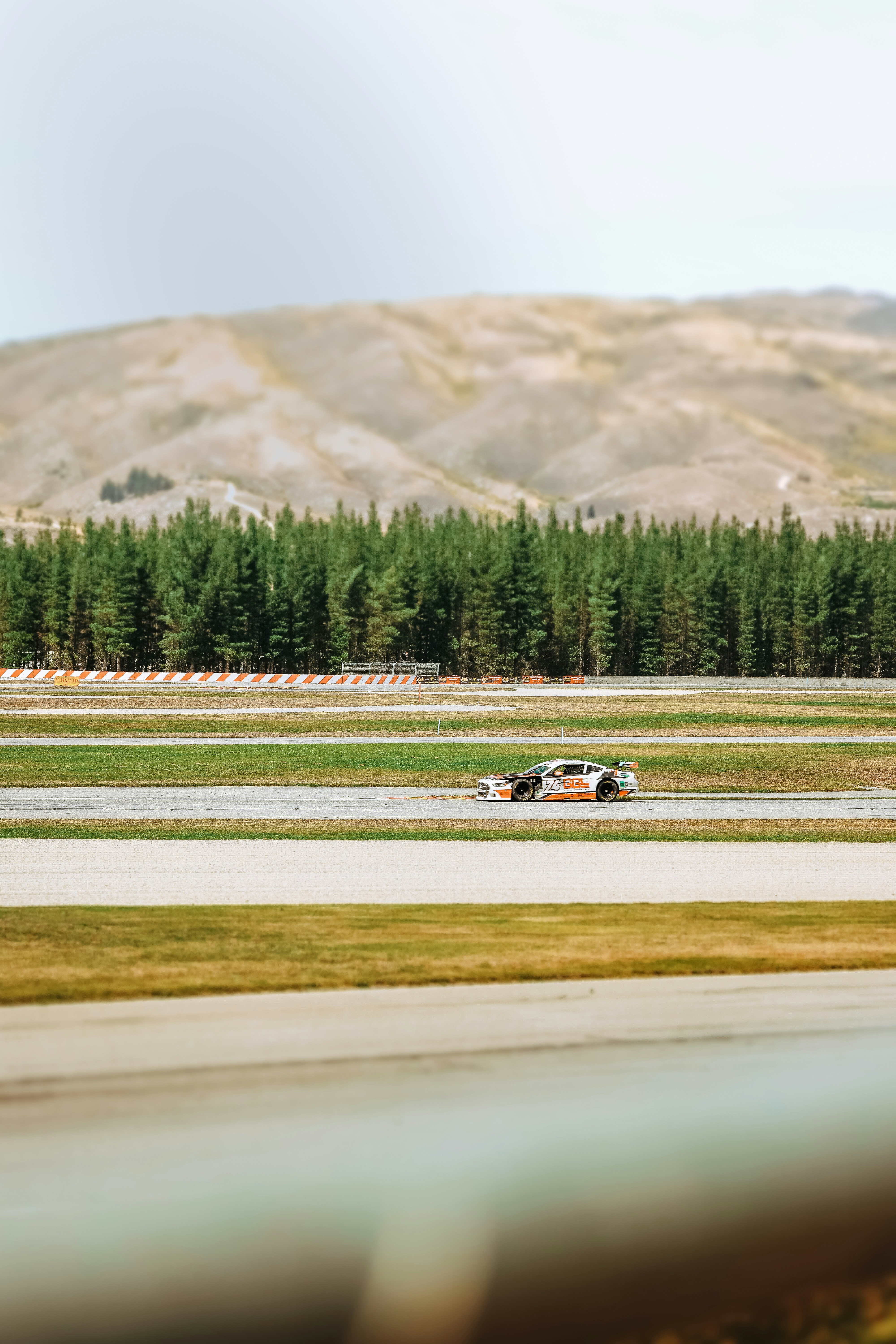 Racing Car Slices Through Quiet Ribbon of Track