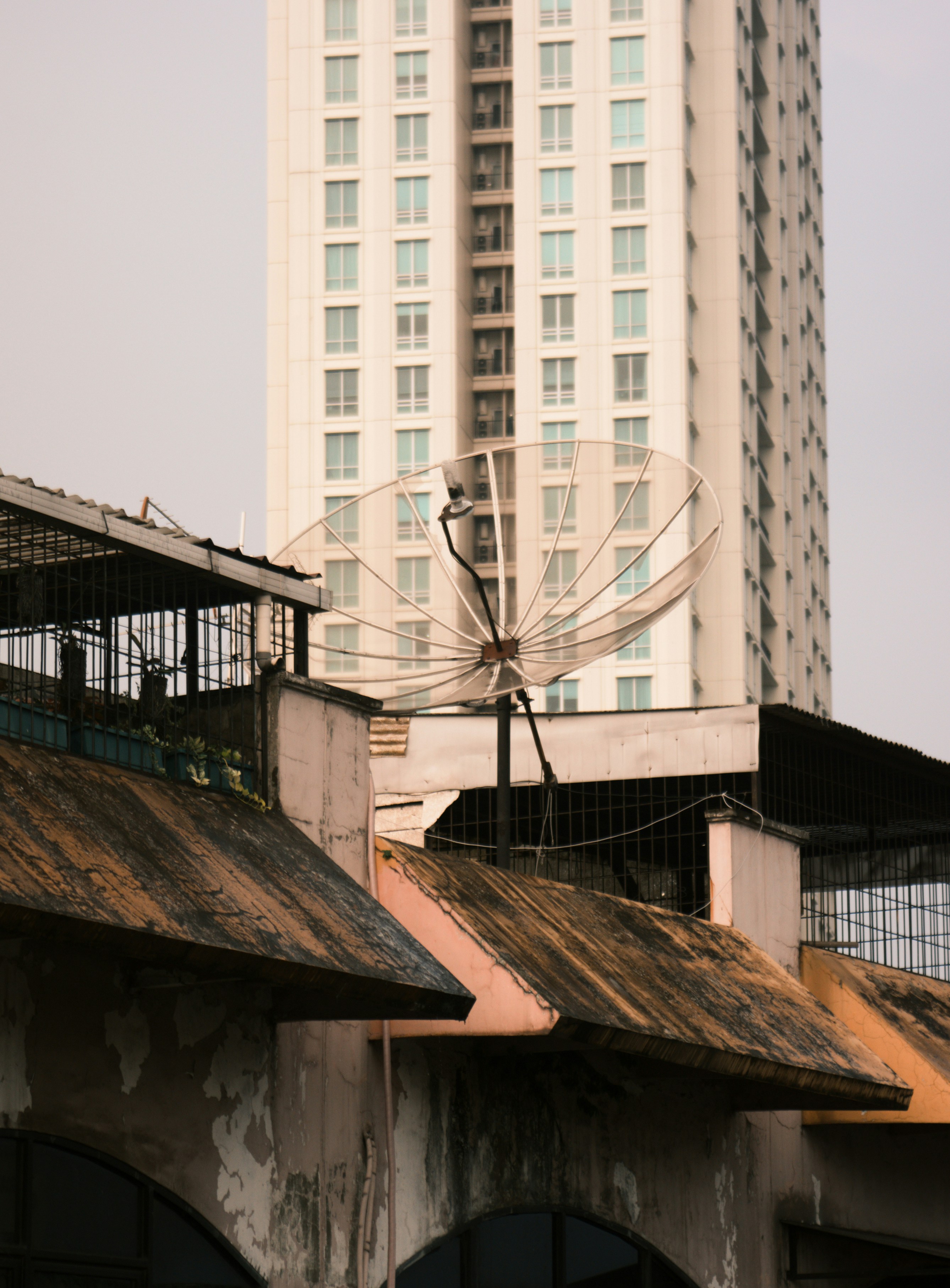 Rooftop Antenna Against a City Spine