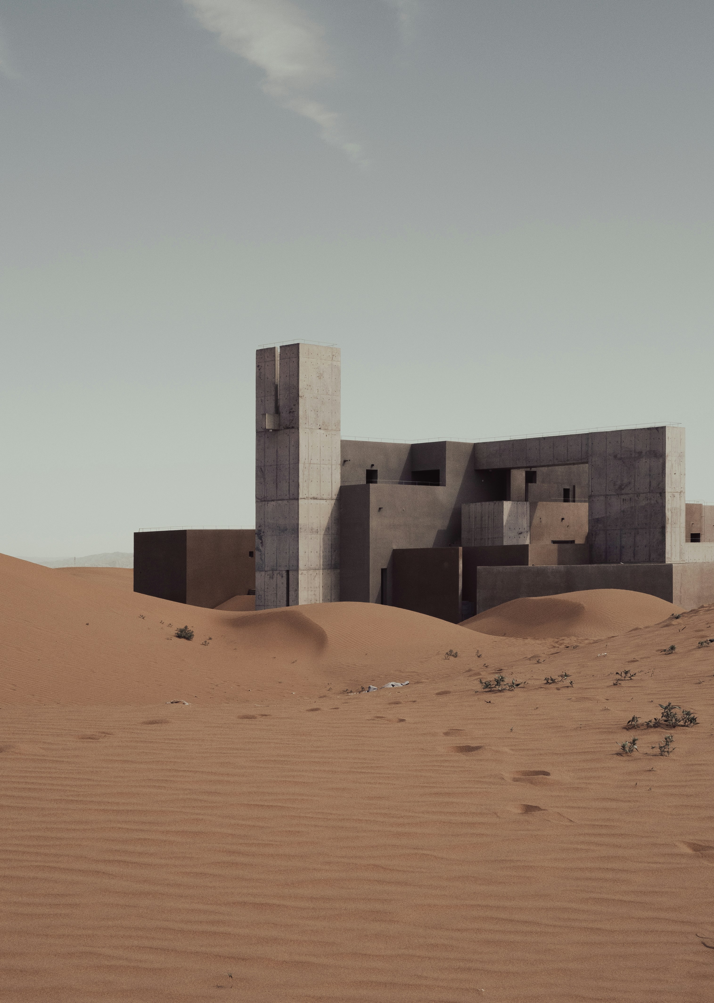 Desert Fortress: Concrete Forms Rising from the Dune Sea