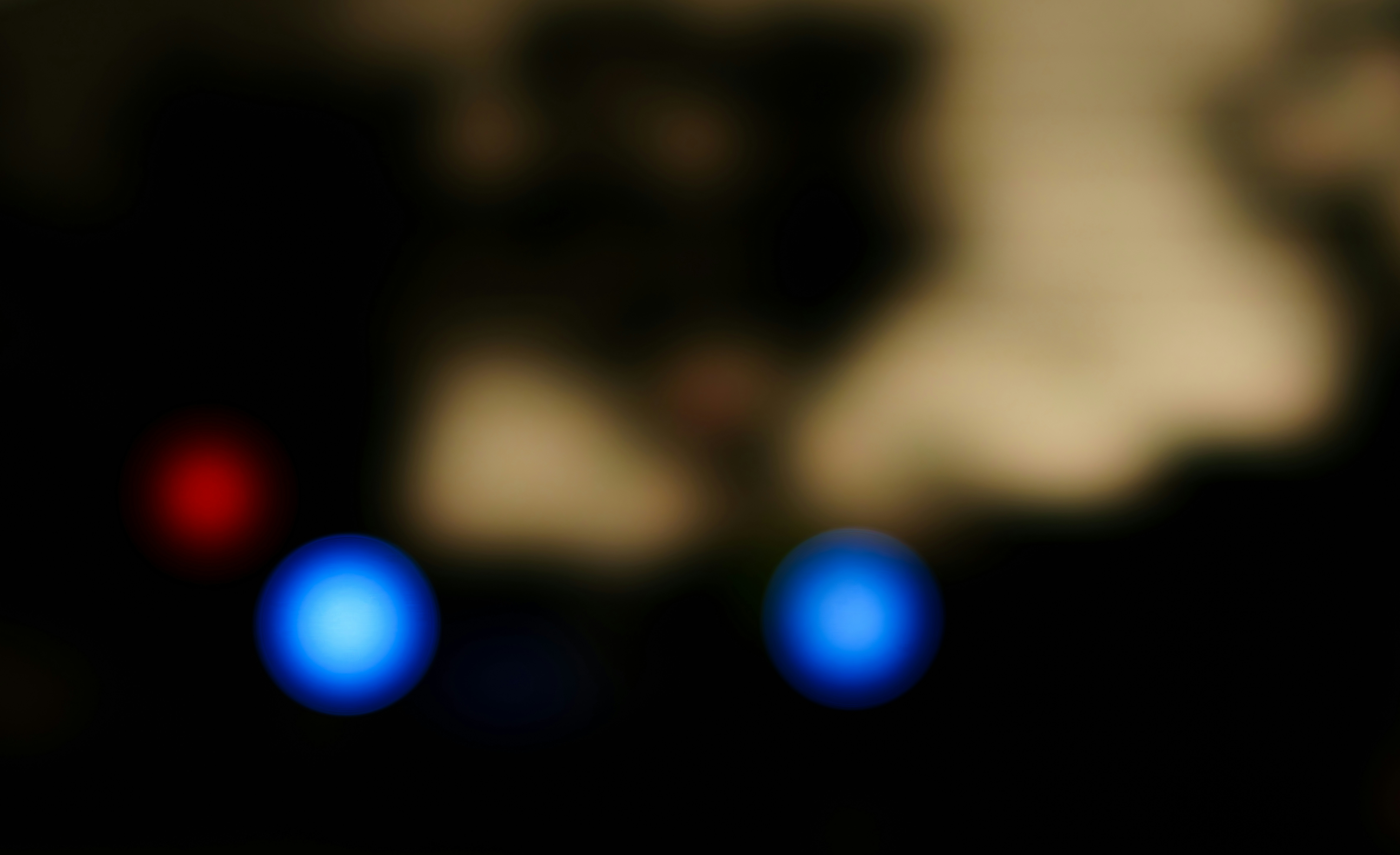 Overheated Neon: Blurred City Lights with a Red Hint