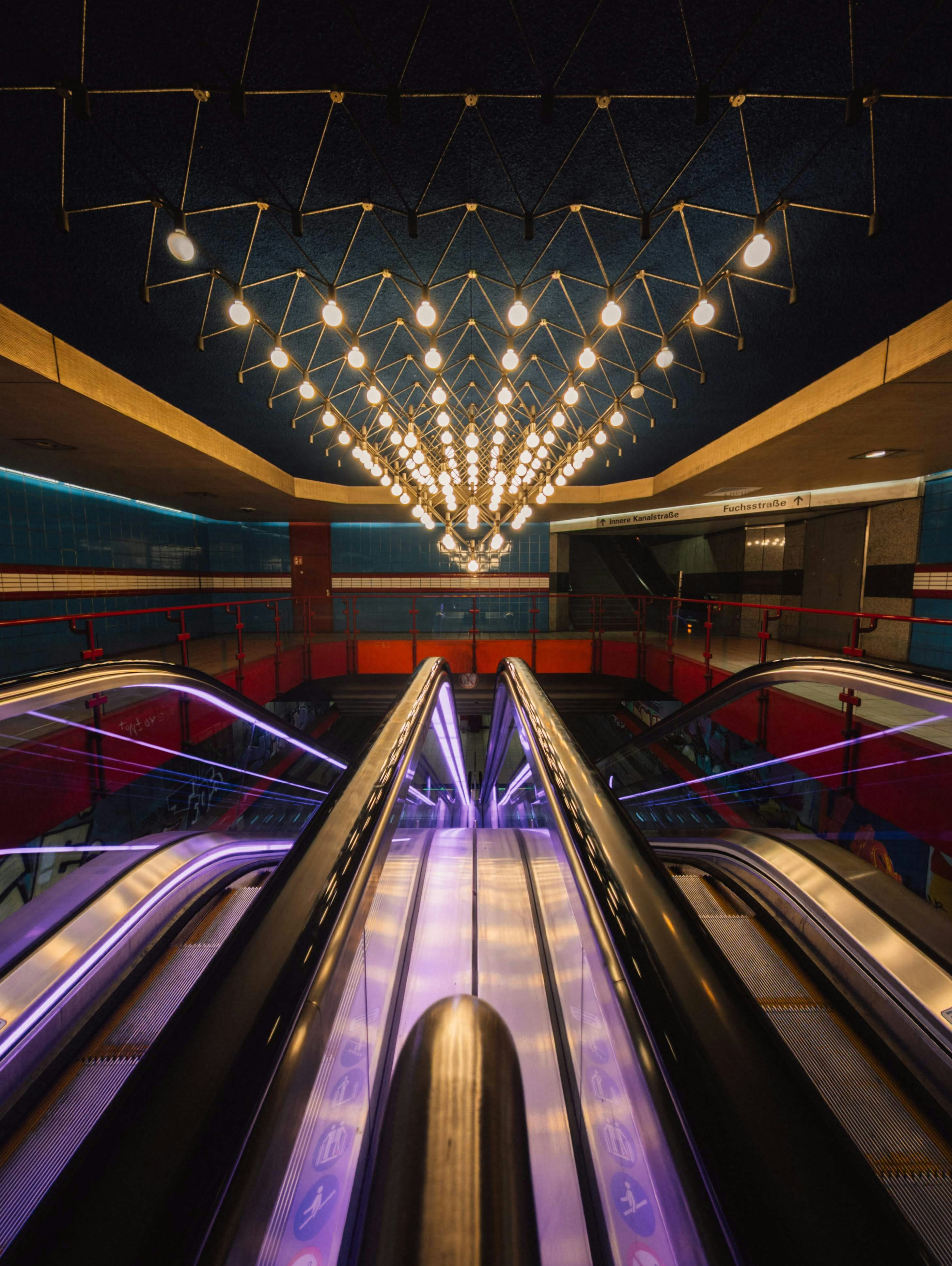 Glow above the Rails: Neon Escalator Convergence