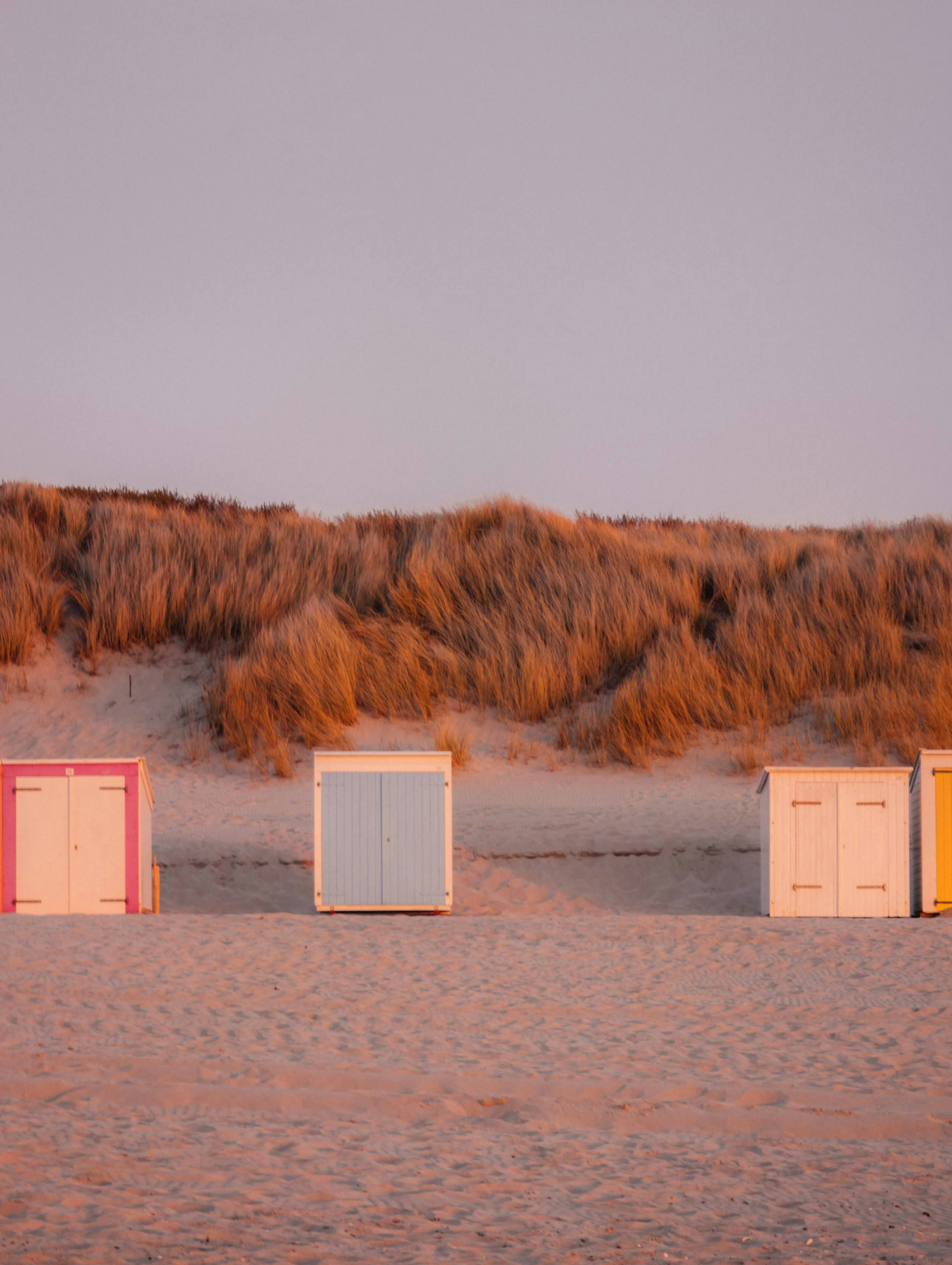 Beach Dune Row: Symmetry of Soft Color and Quiet Doors