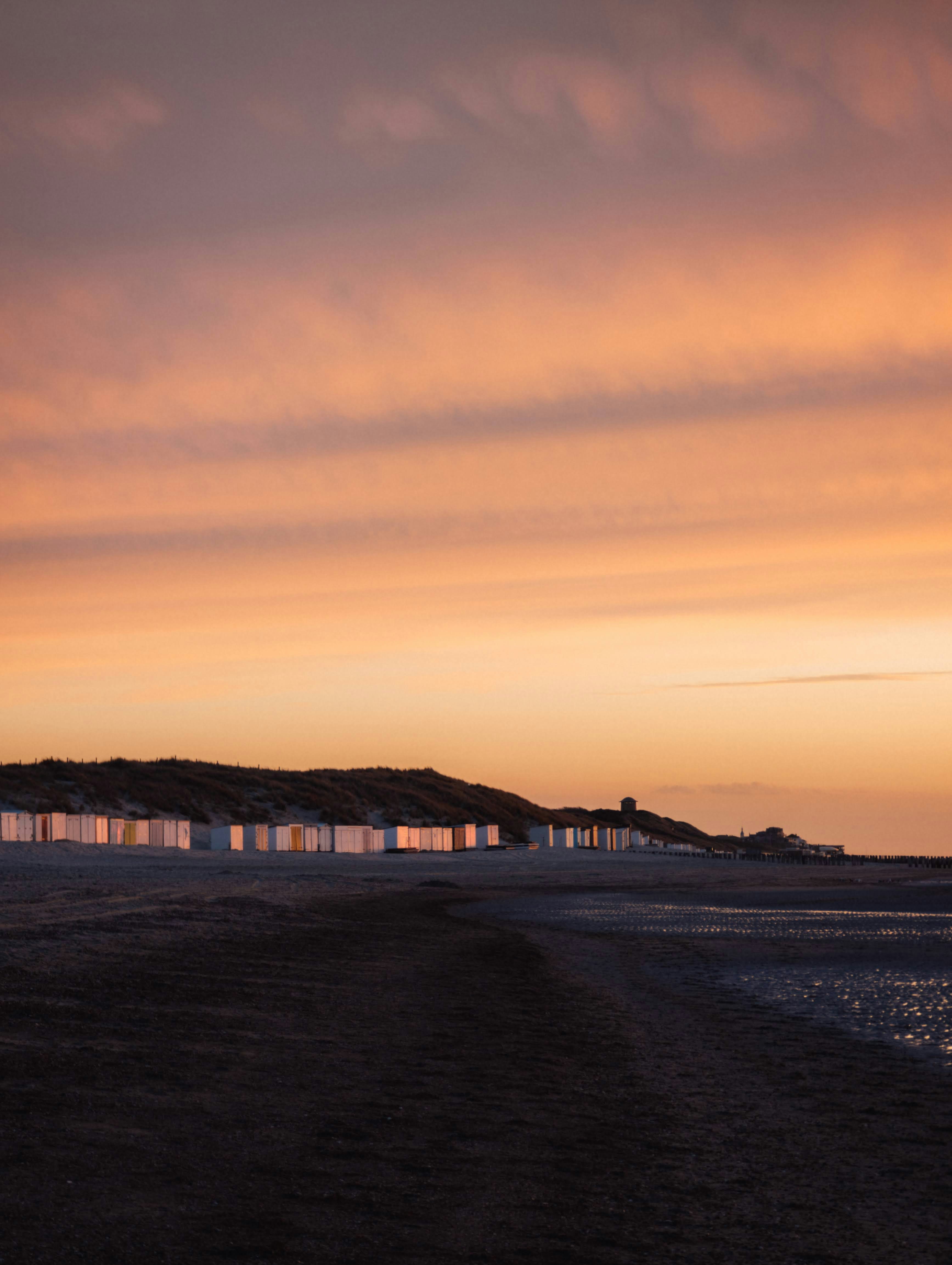 Dusk on the Dunes: Quiet Beach with Colorful Horizon