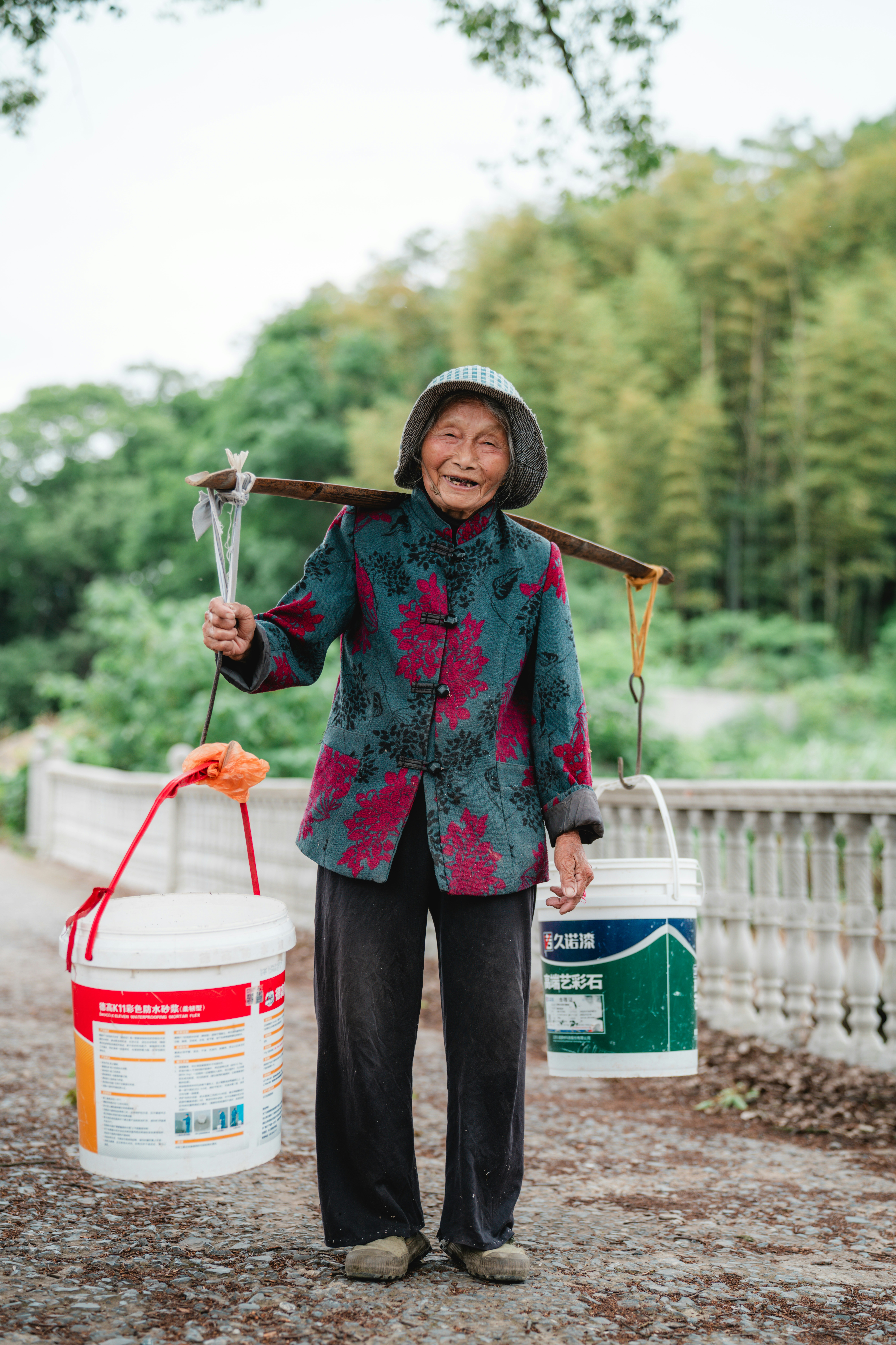 The Lantern Carrier: Elderly Tap Tufts of Color Across the Path