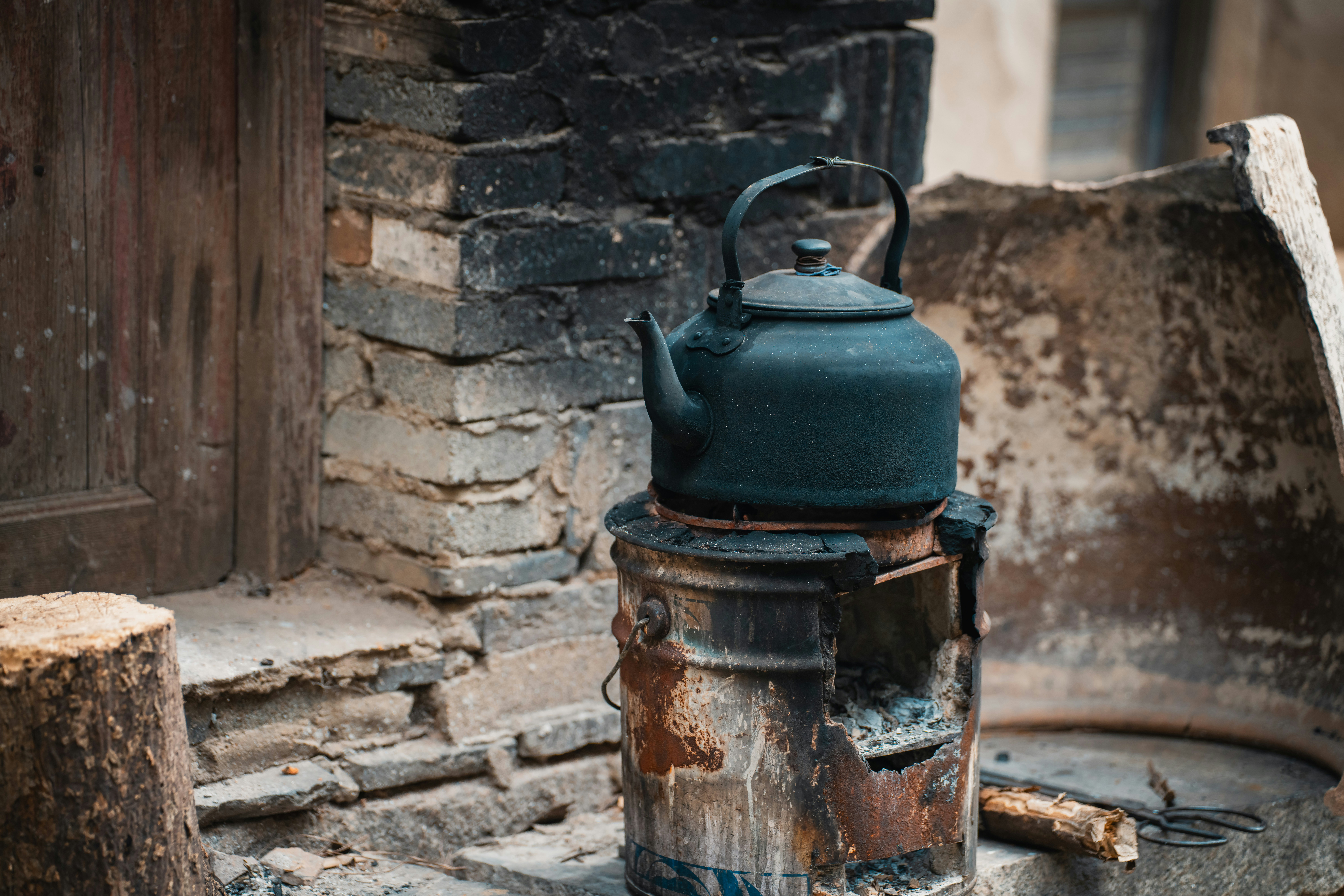 Steam and Stone: A Weathered Kettle Guards the Well-Worn Camp