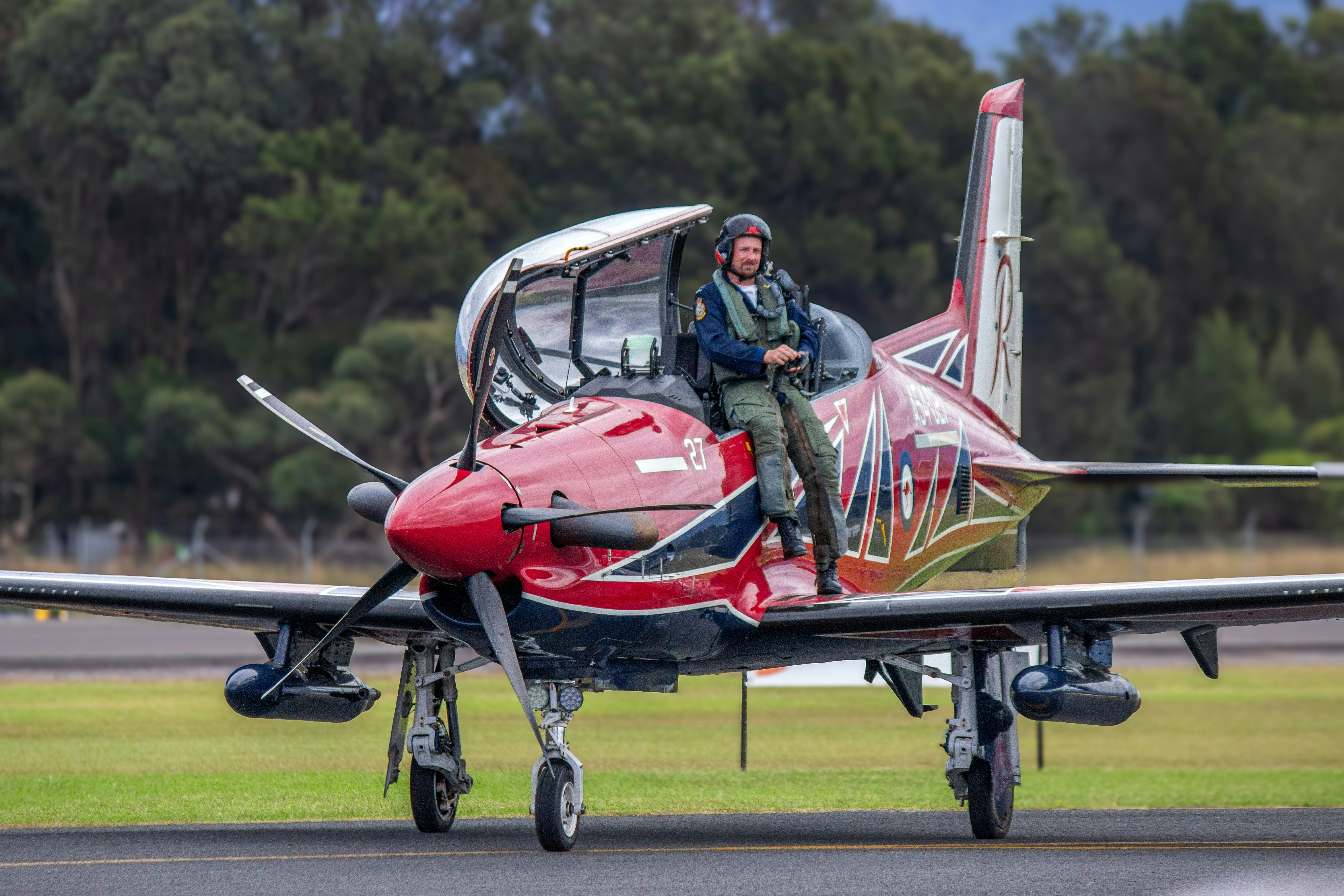 Pilot's Red Mirage: A Vintage Jet sits ready on the tarmac