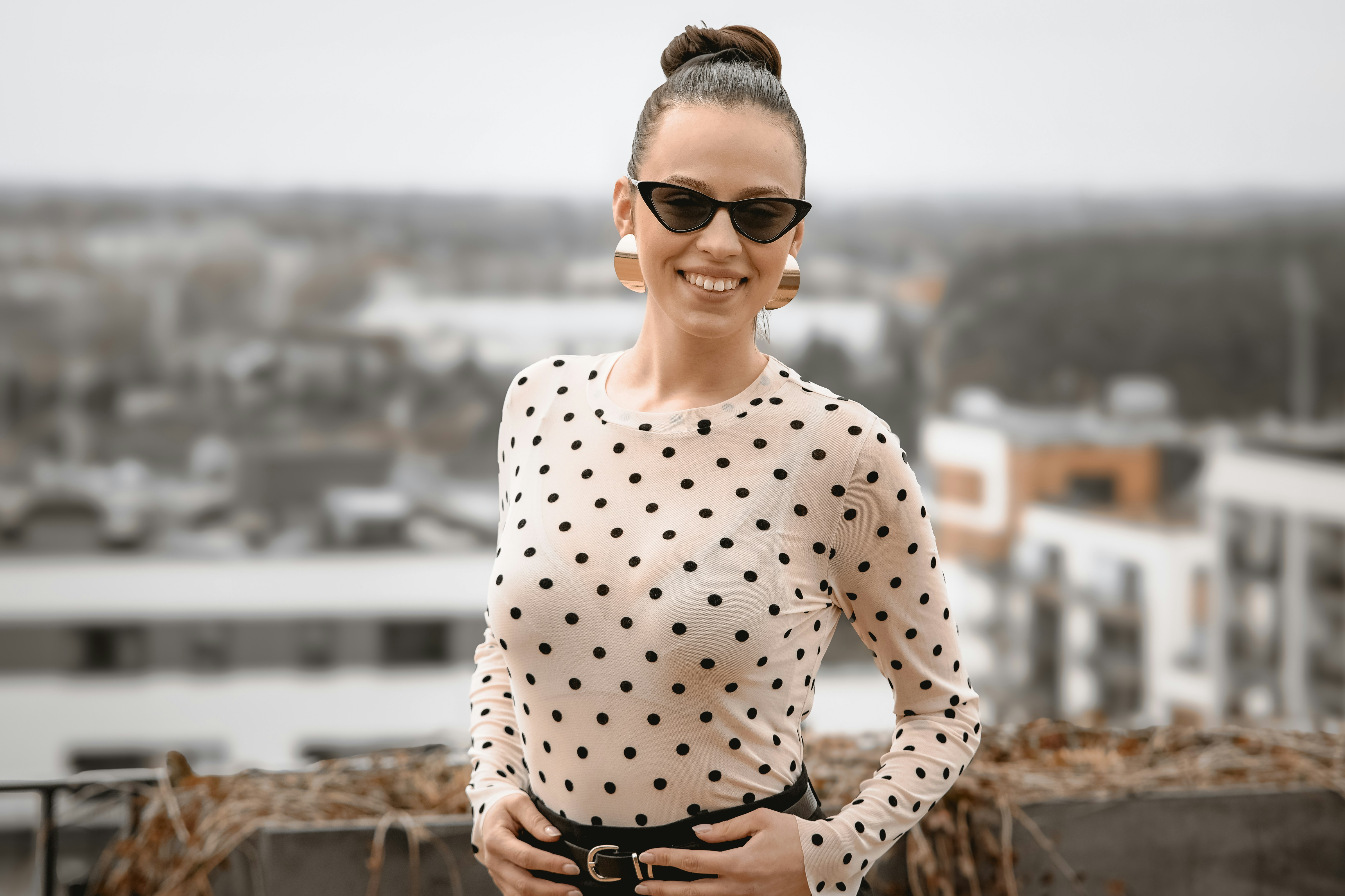 Polished Confidence: Polka-Dotted Pulse on the Rooftop