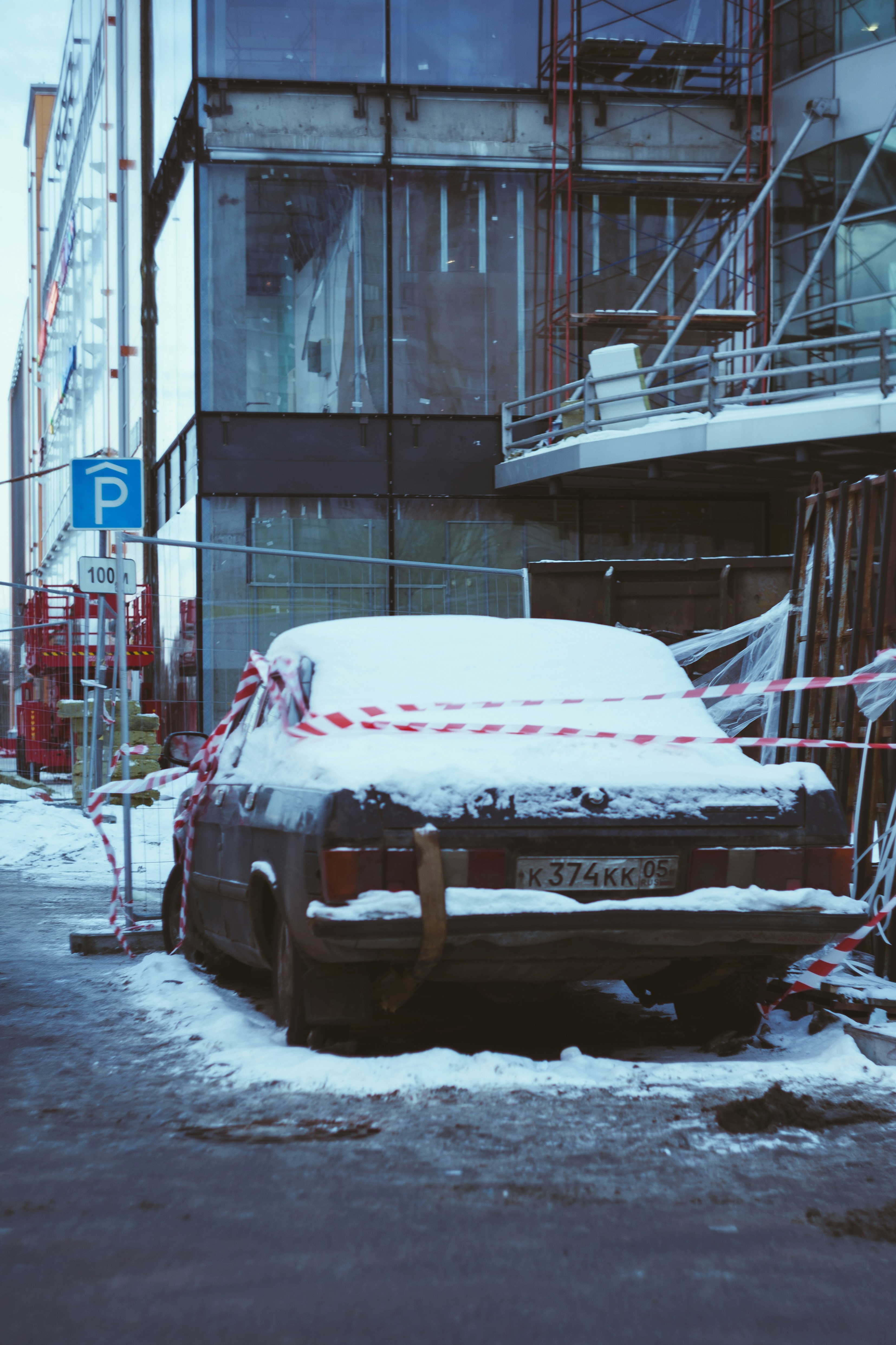 Snowbound Car in a Cramped Urban Channel