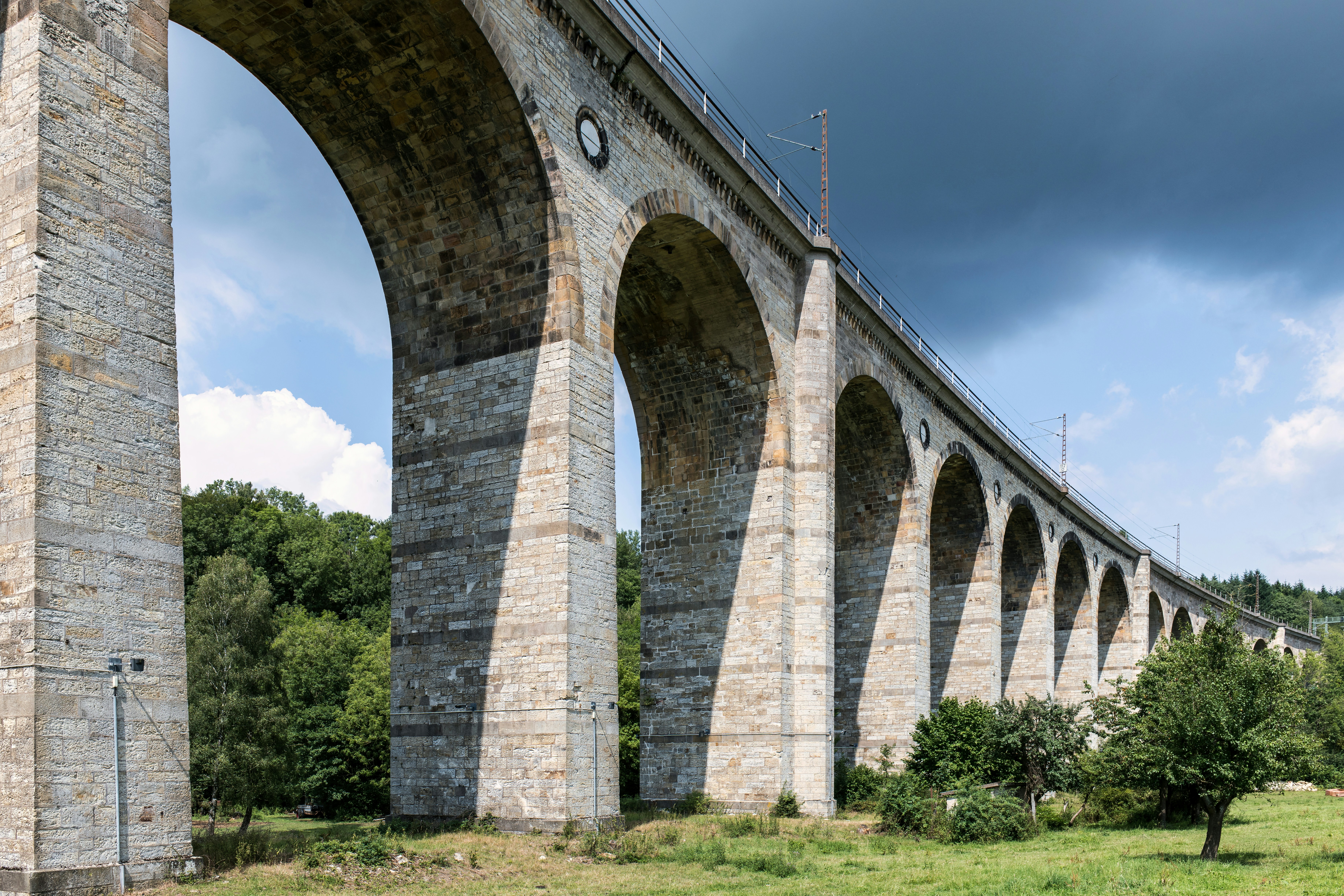 Stone Viaduct Arcades under a Wide Sky