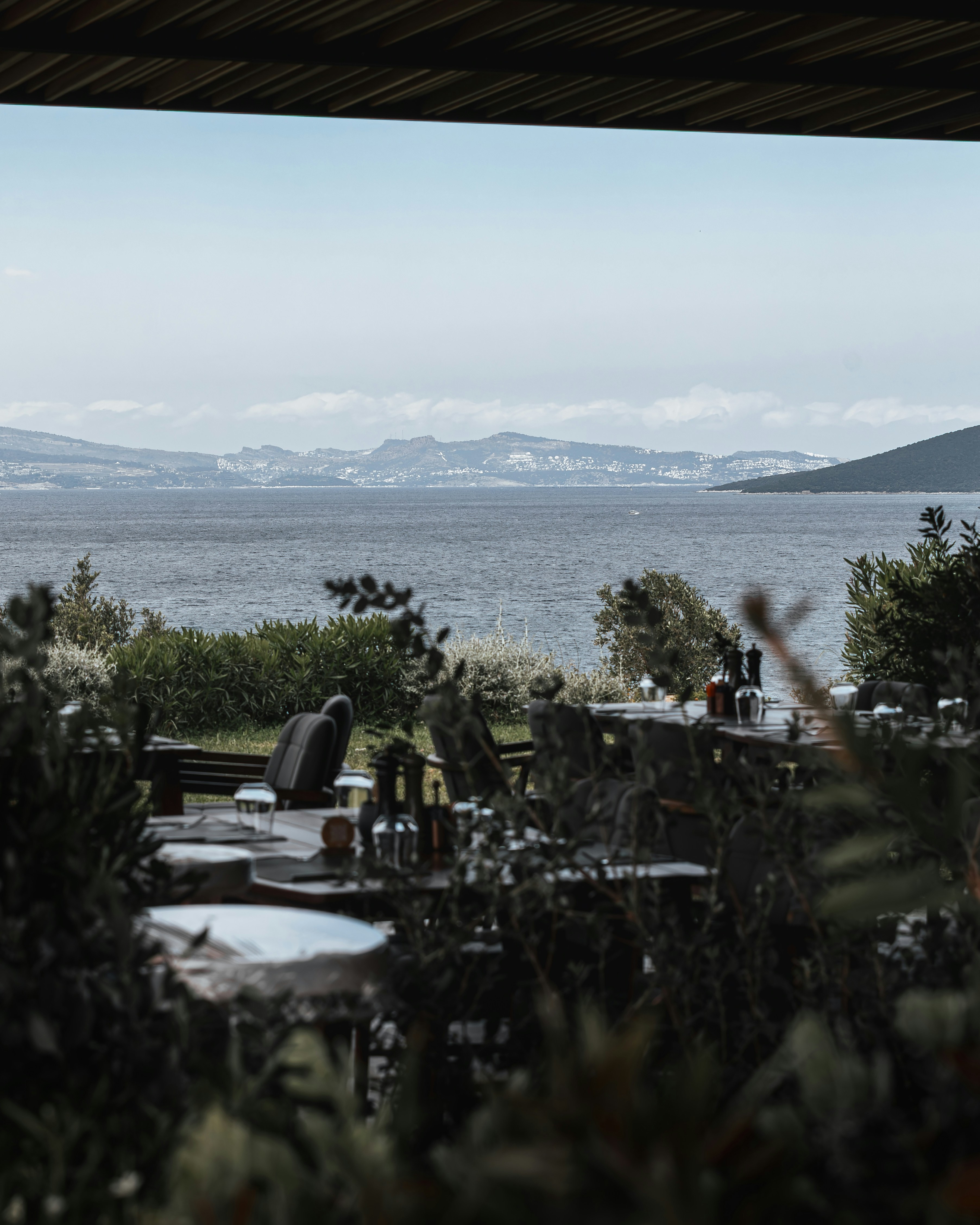 Seaside Terrace Beneath a Shadowed Overhang
