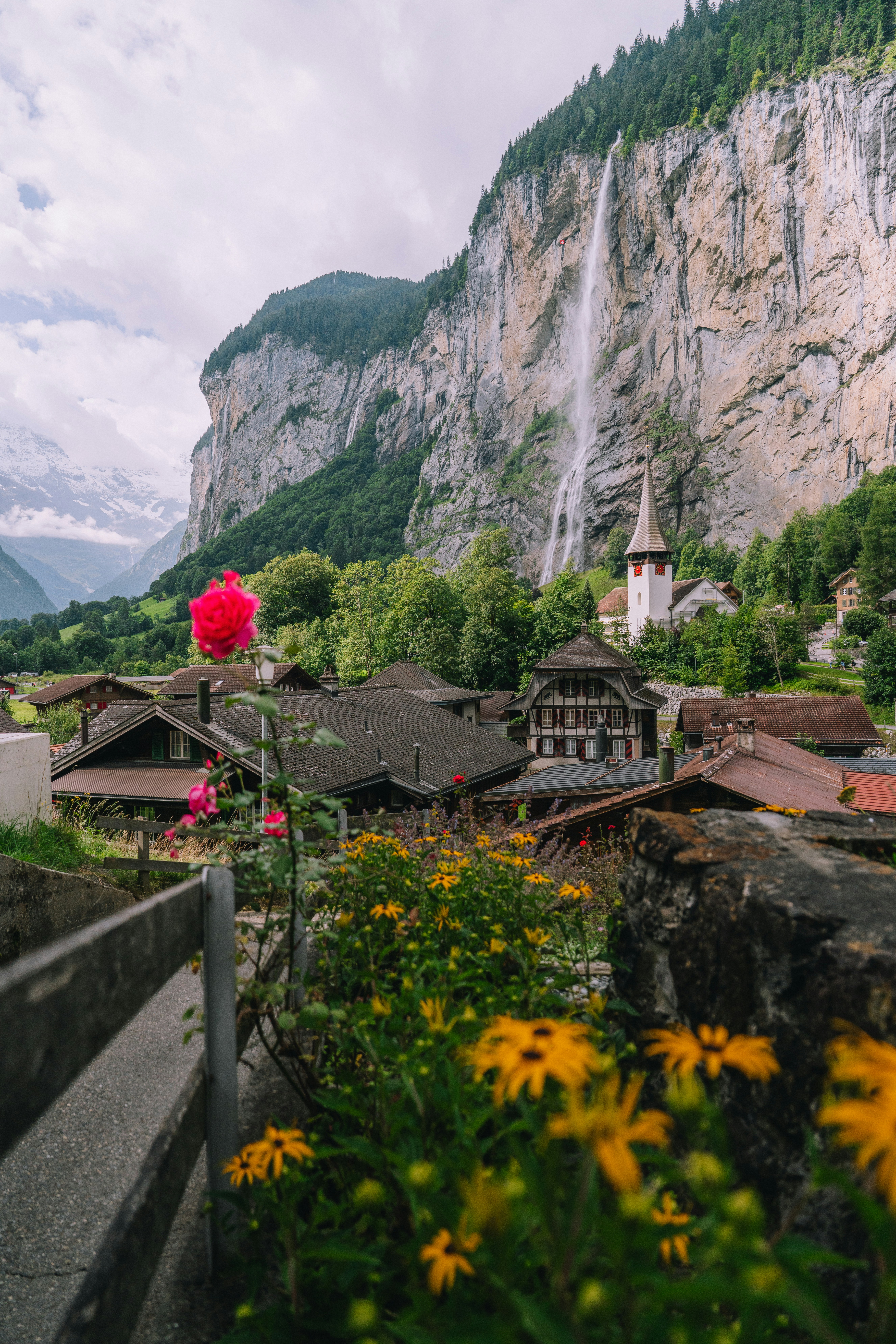 Cascade Over the Village: A Swiss Valley Morning