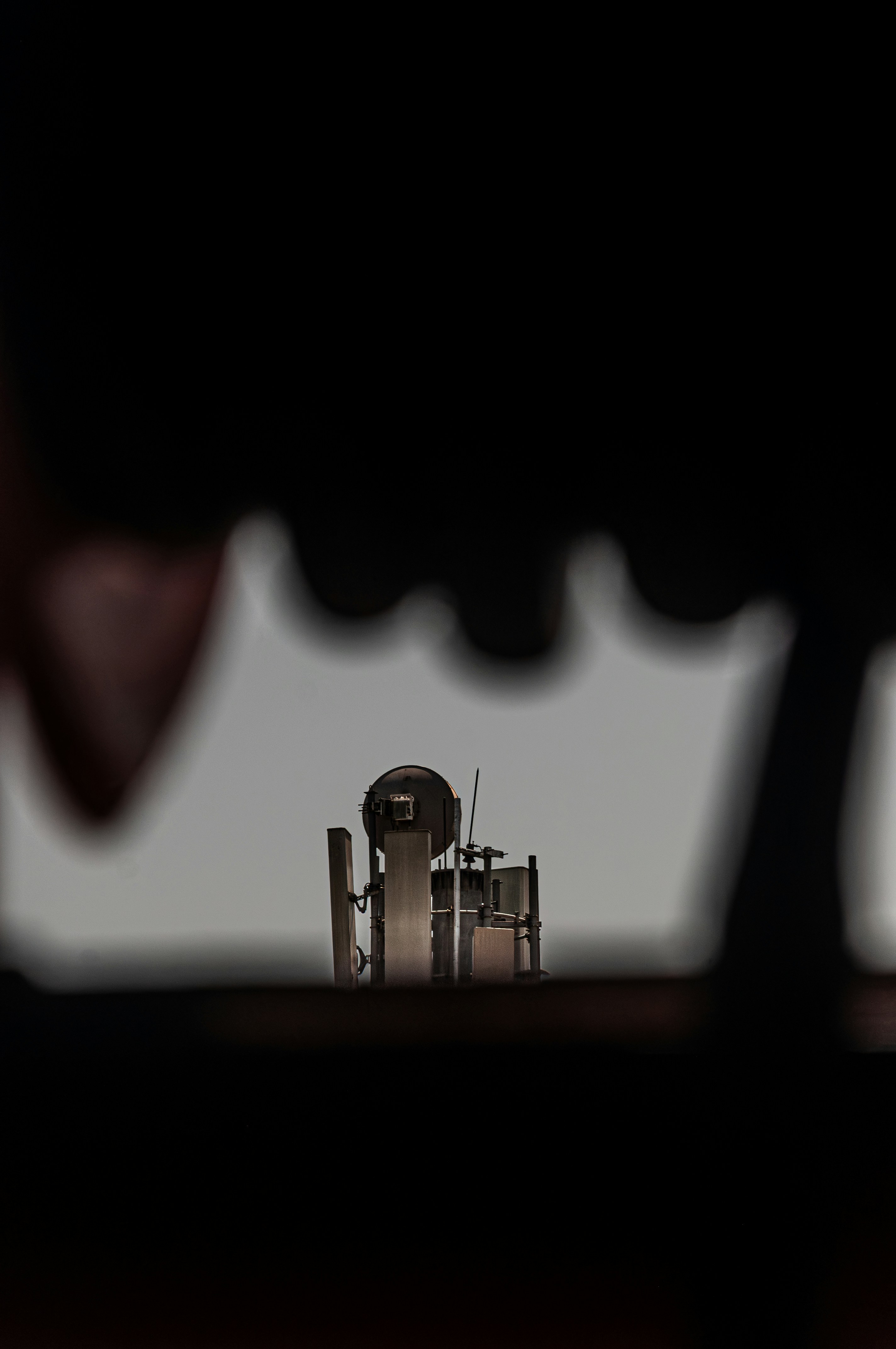 Miniature Telescope Crown: A Rooftop Antenna Emerges in Focus