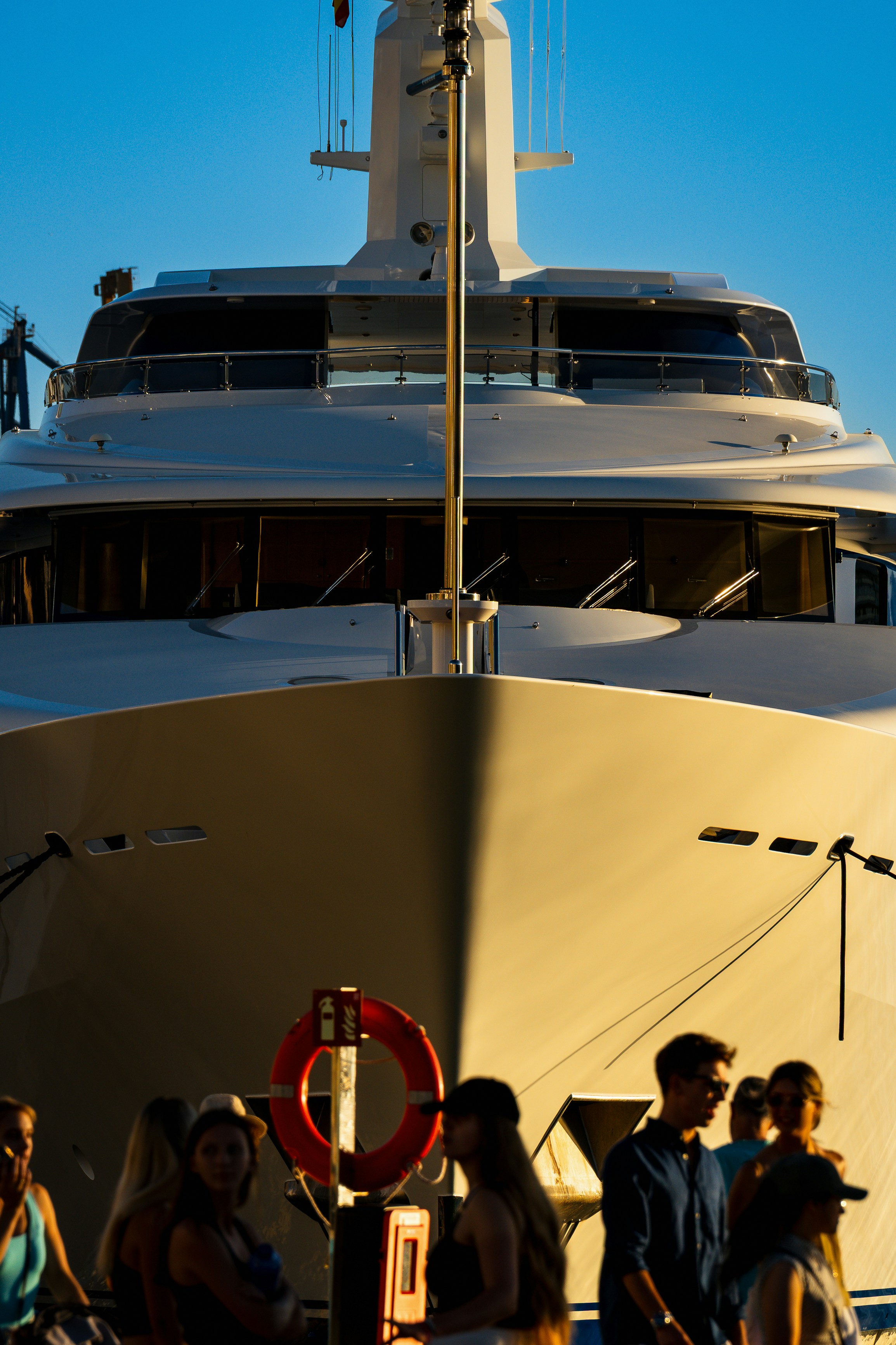 Majestic Bow: The Forward Face of a Yacht Under a Summer Sky
