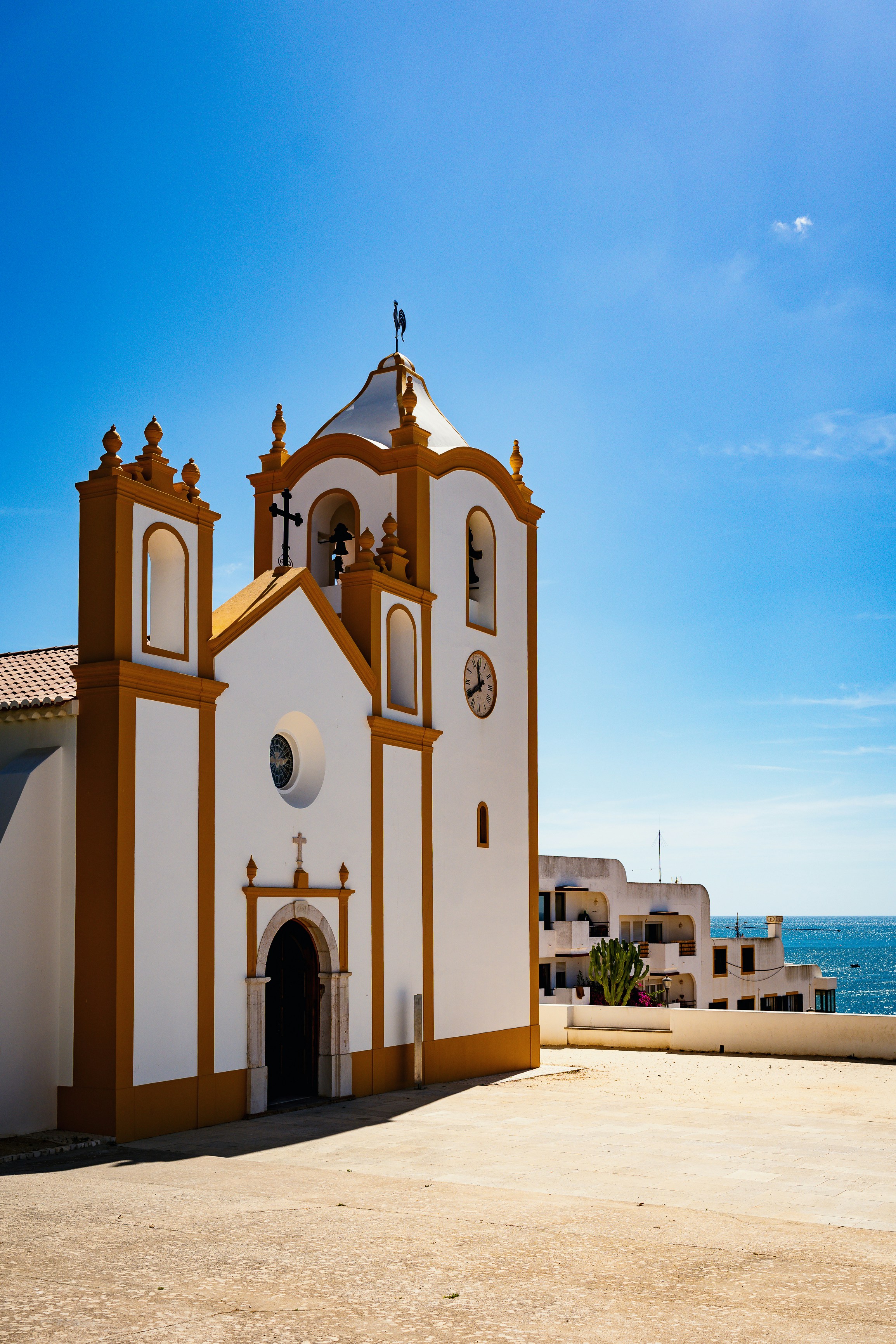Sunlit Mission: A Coastal Church Beckons by the Caribbean Sea