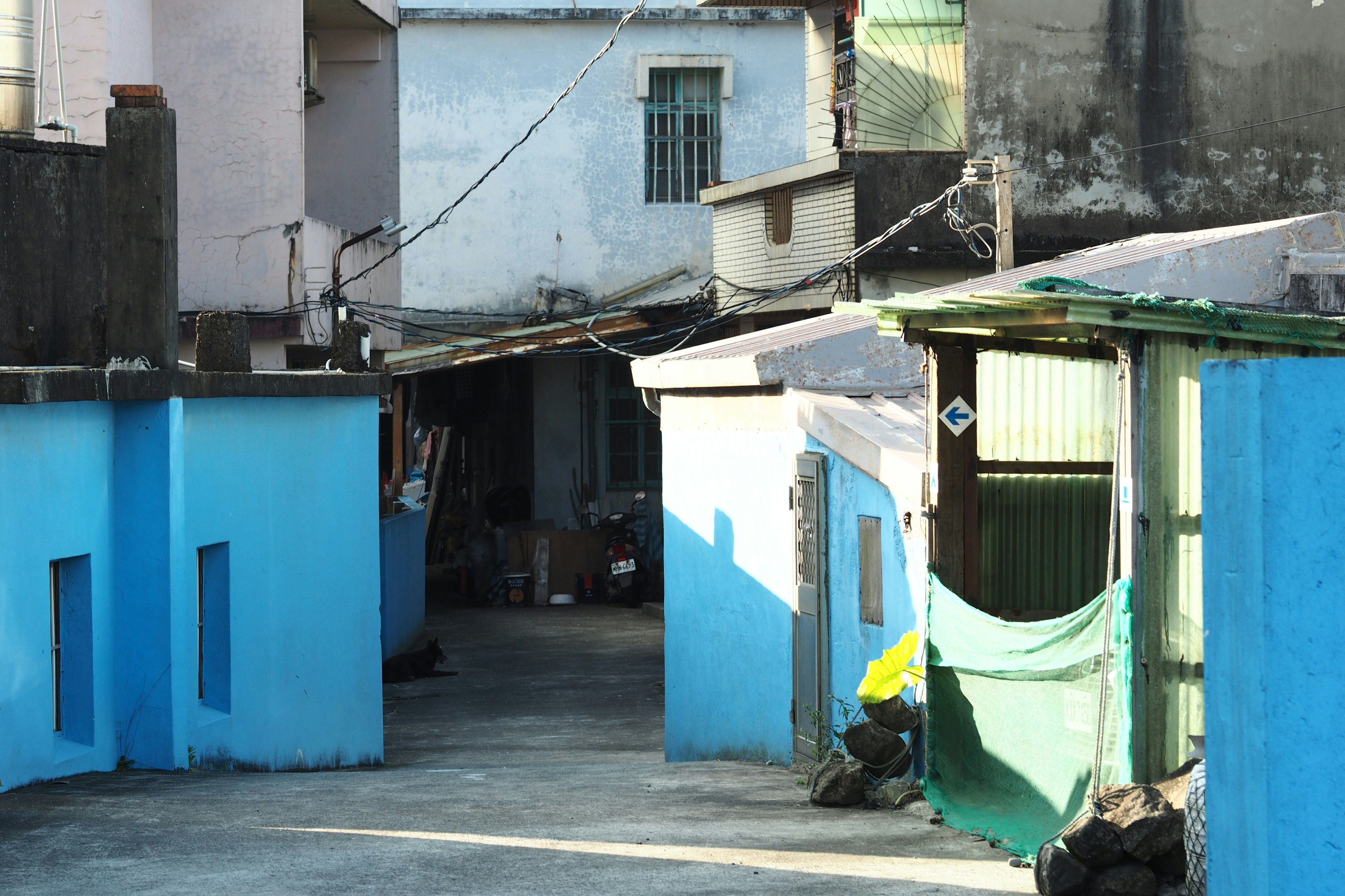 Blue Alleys and Sunlit Courtyard