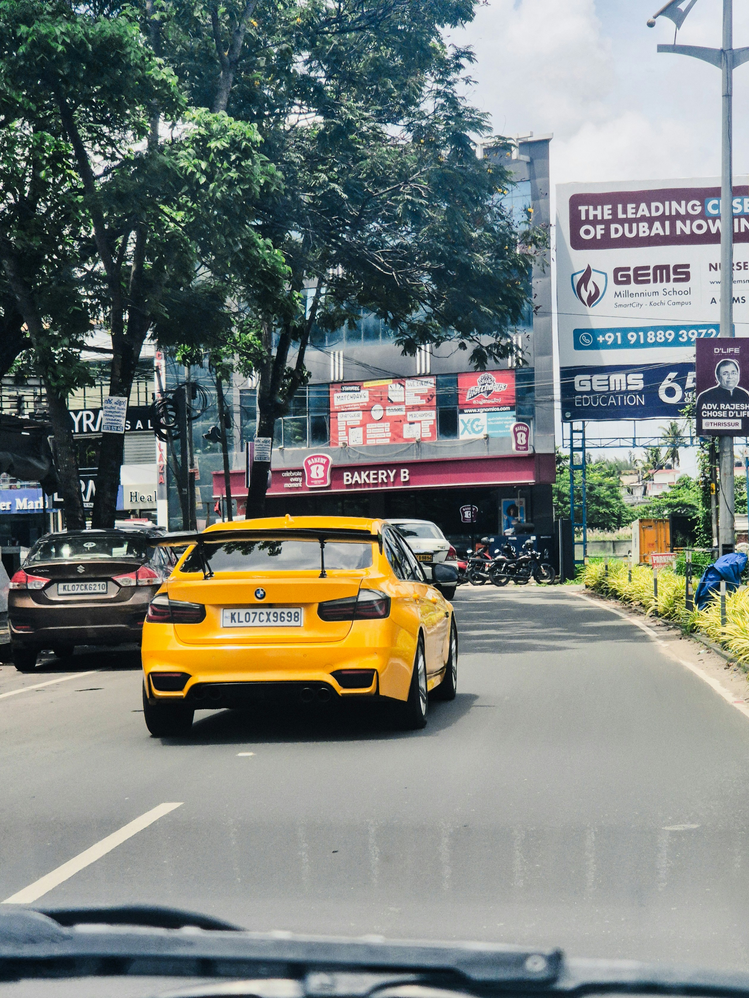Yellow Thunderbird: A Street Scene with a Bold City Taxi in Focus