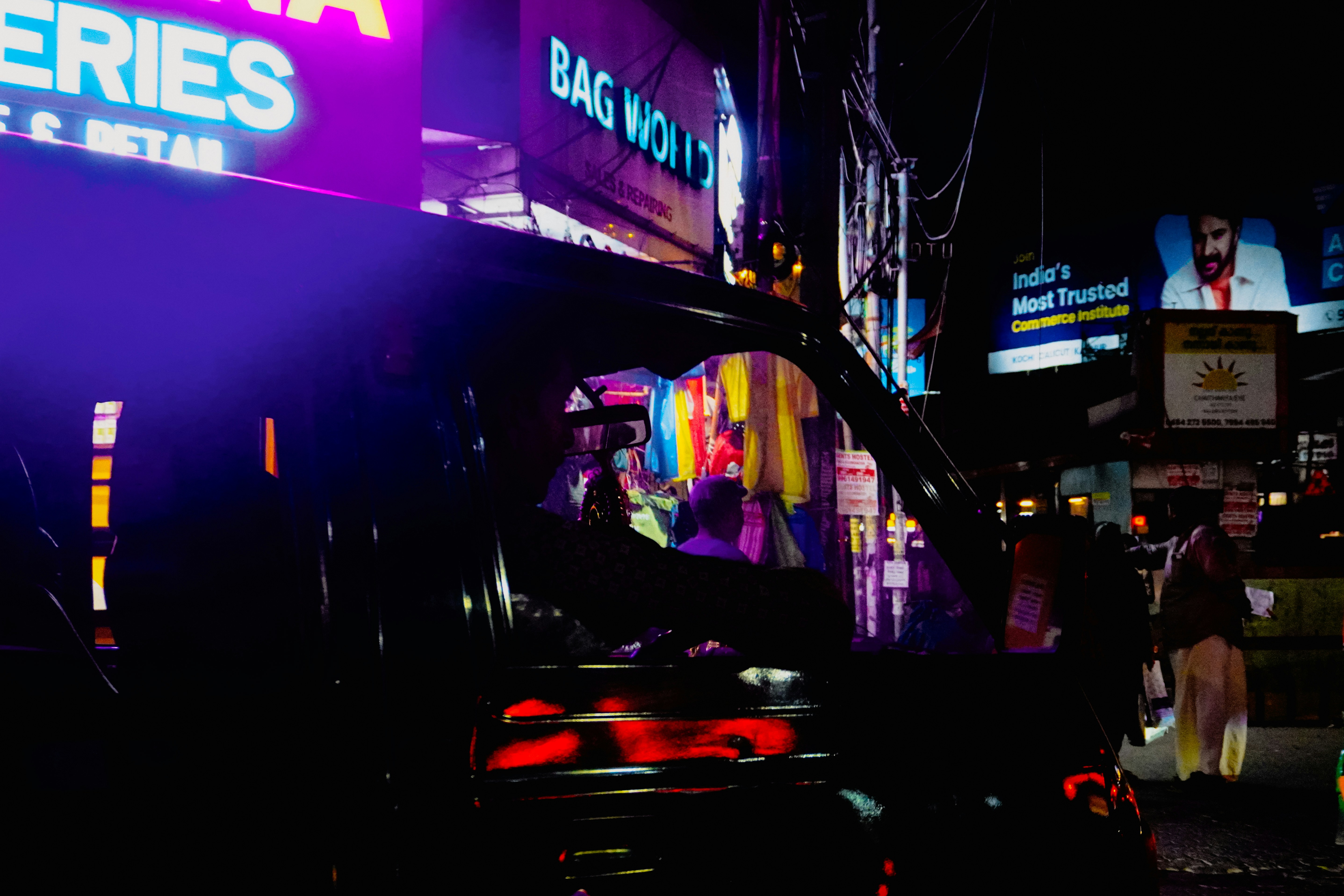 Neon Nightlife: A Taxi Wake in the City Loop