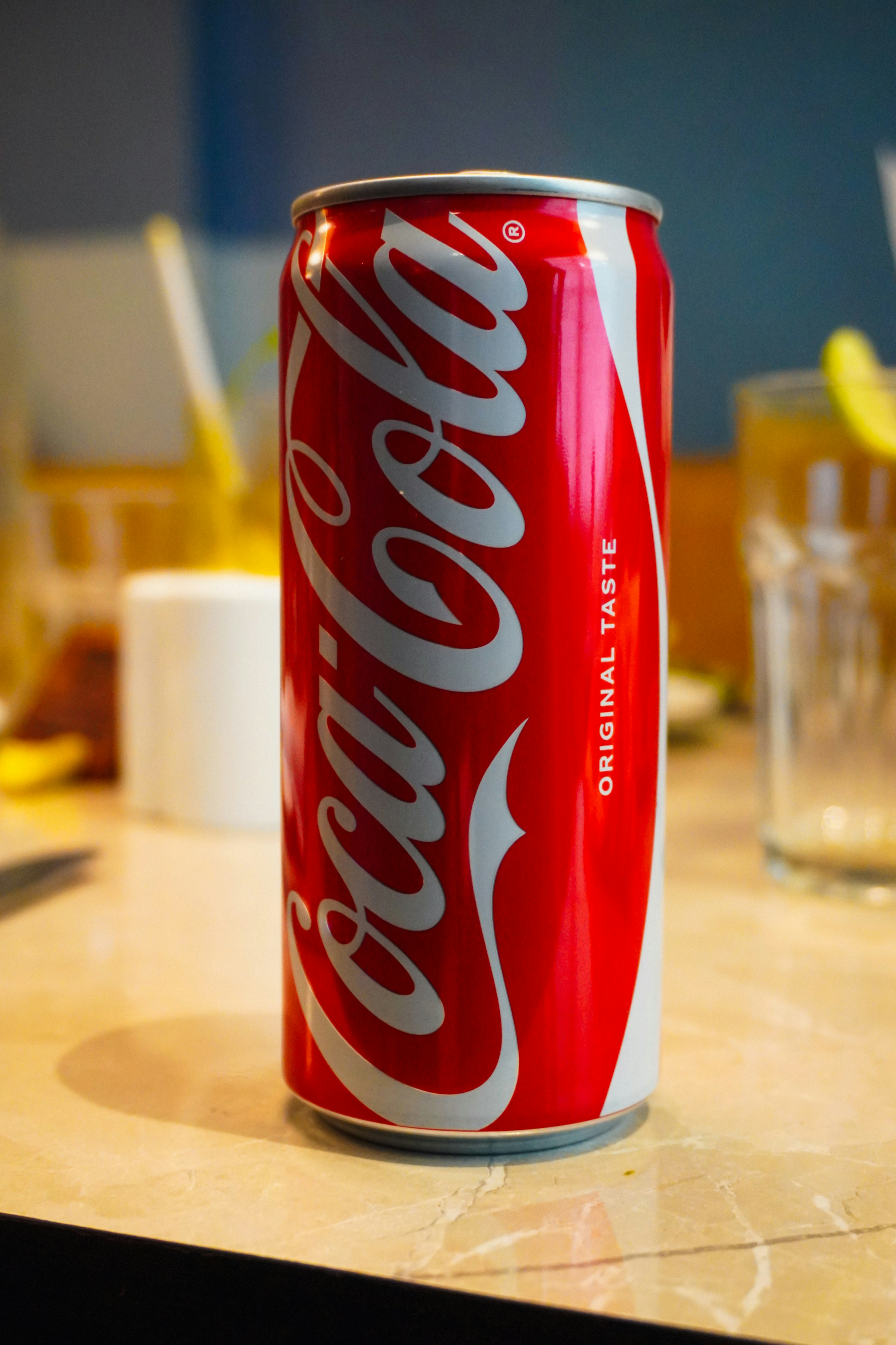 Coca-Cola Can in Sharp Focus on a Warm Table Scene