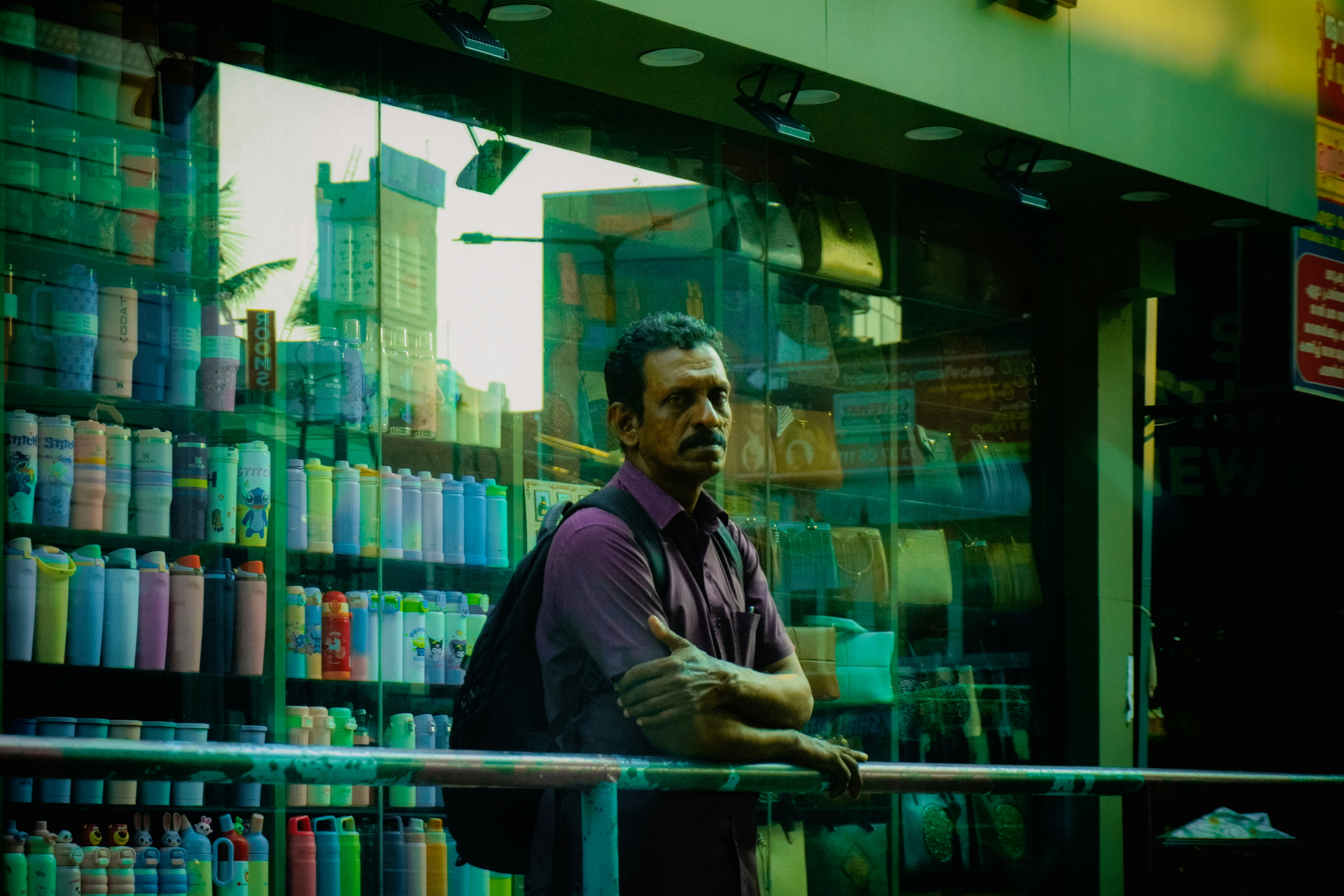 The City Framer: Portrait of Vigilant Calm Amid Colorful Aisles
