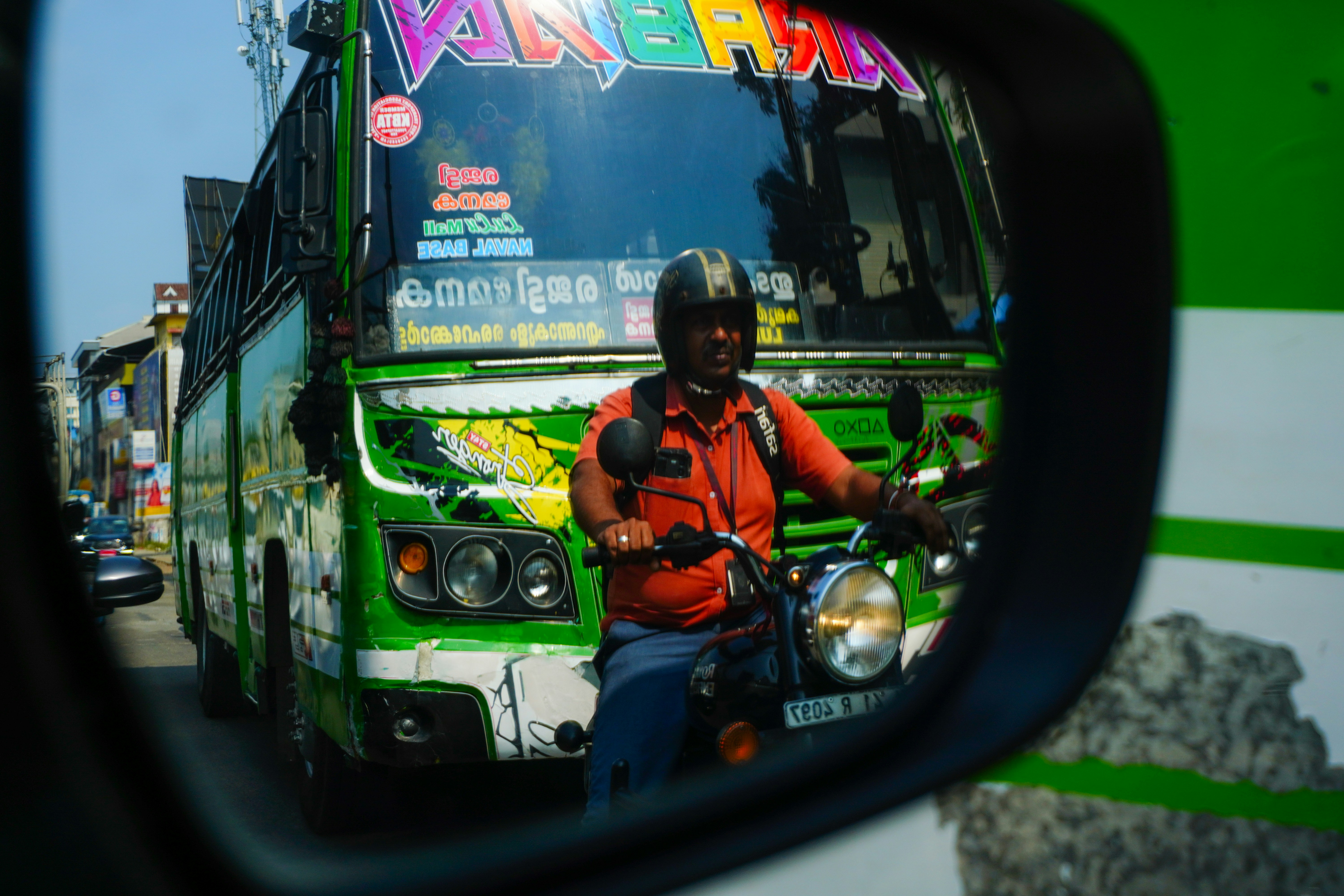 Front-Row View Through a Bus Driver’s Mirror
