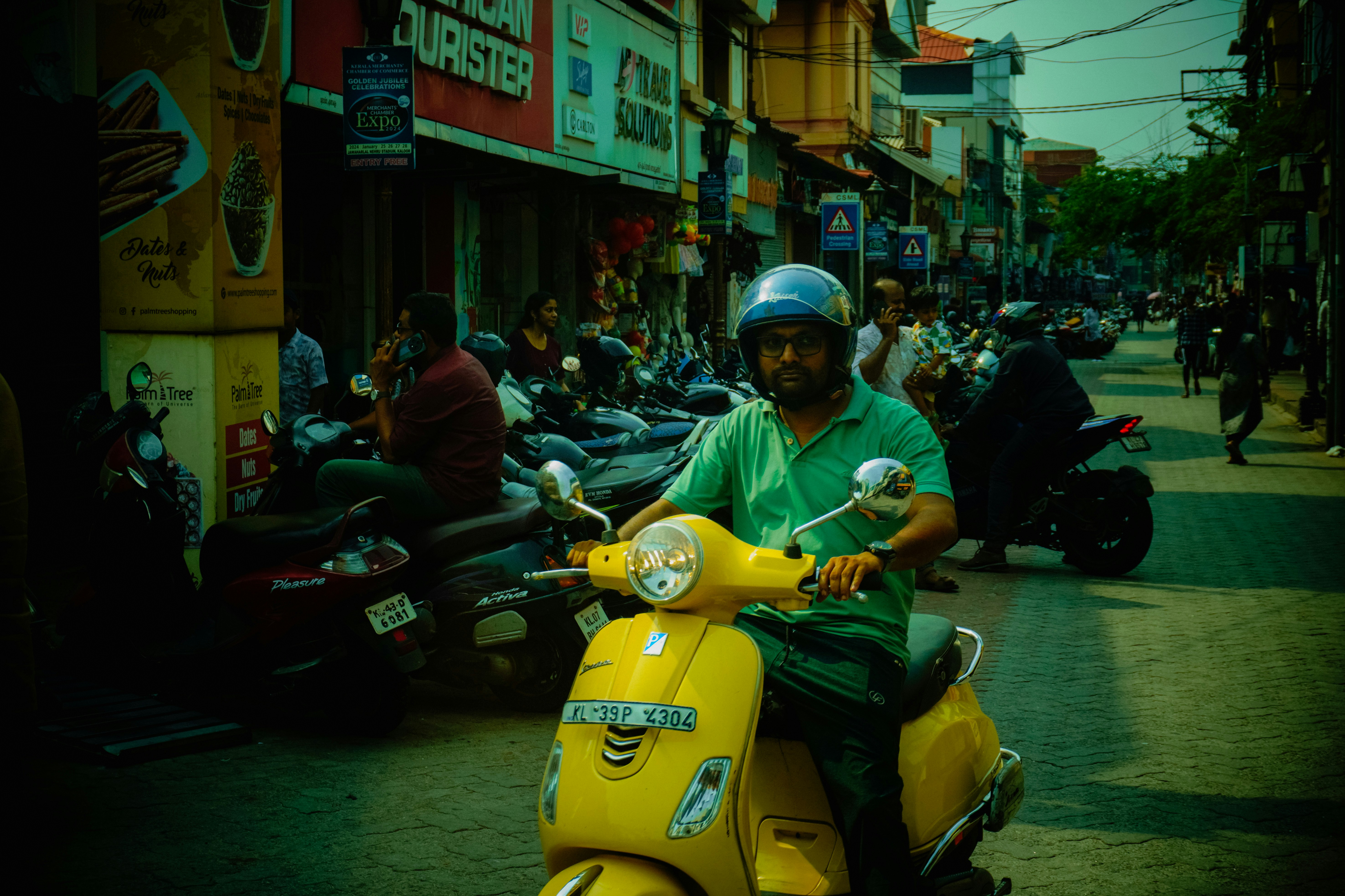 Yellow Rider in a Busy Alley: A Moment on the Pushpedal Street