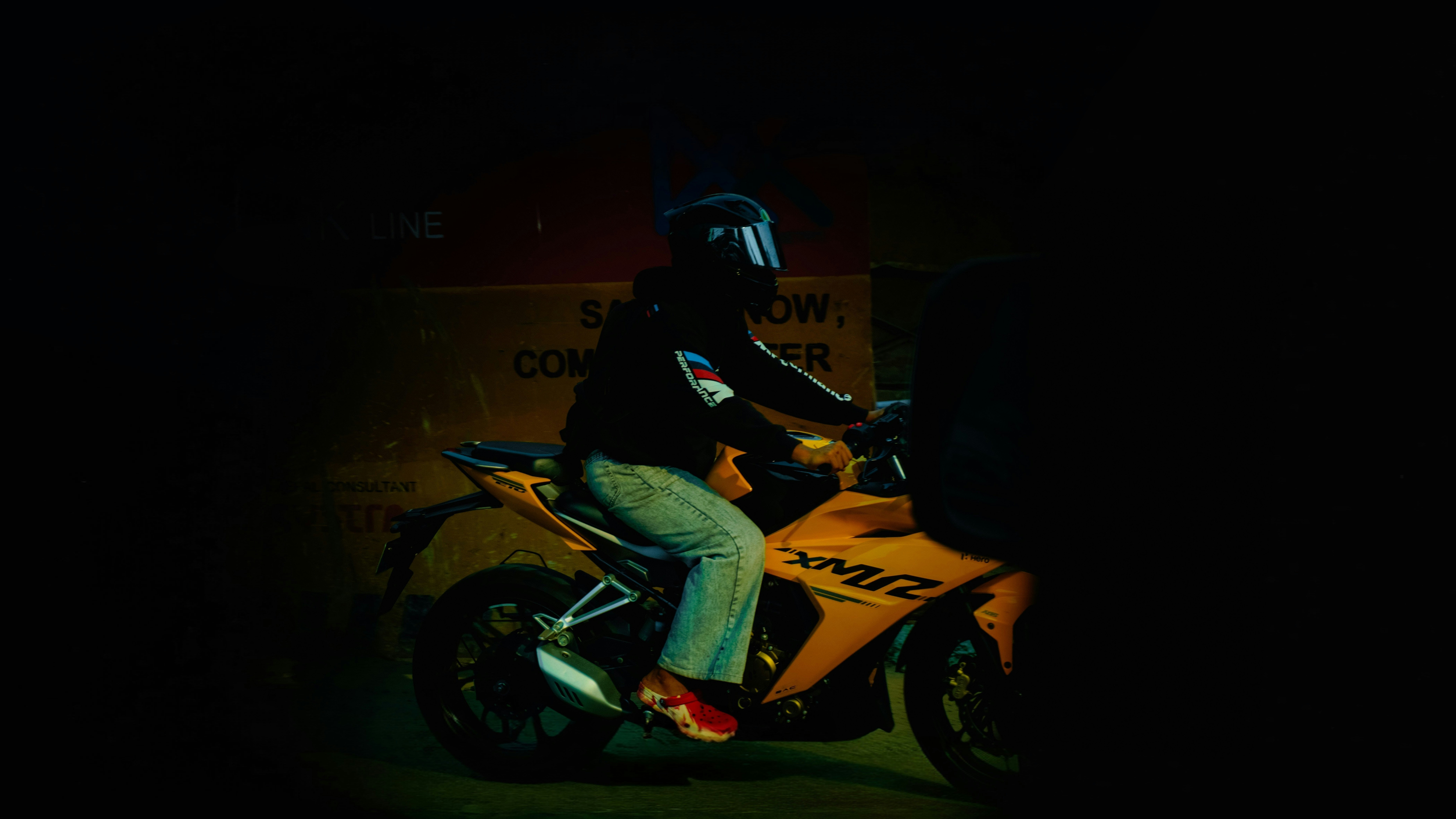 Midnight Ride: A Rider Emerges Against the Neon Glow