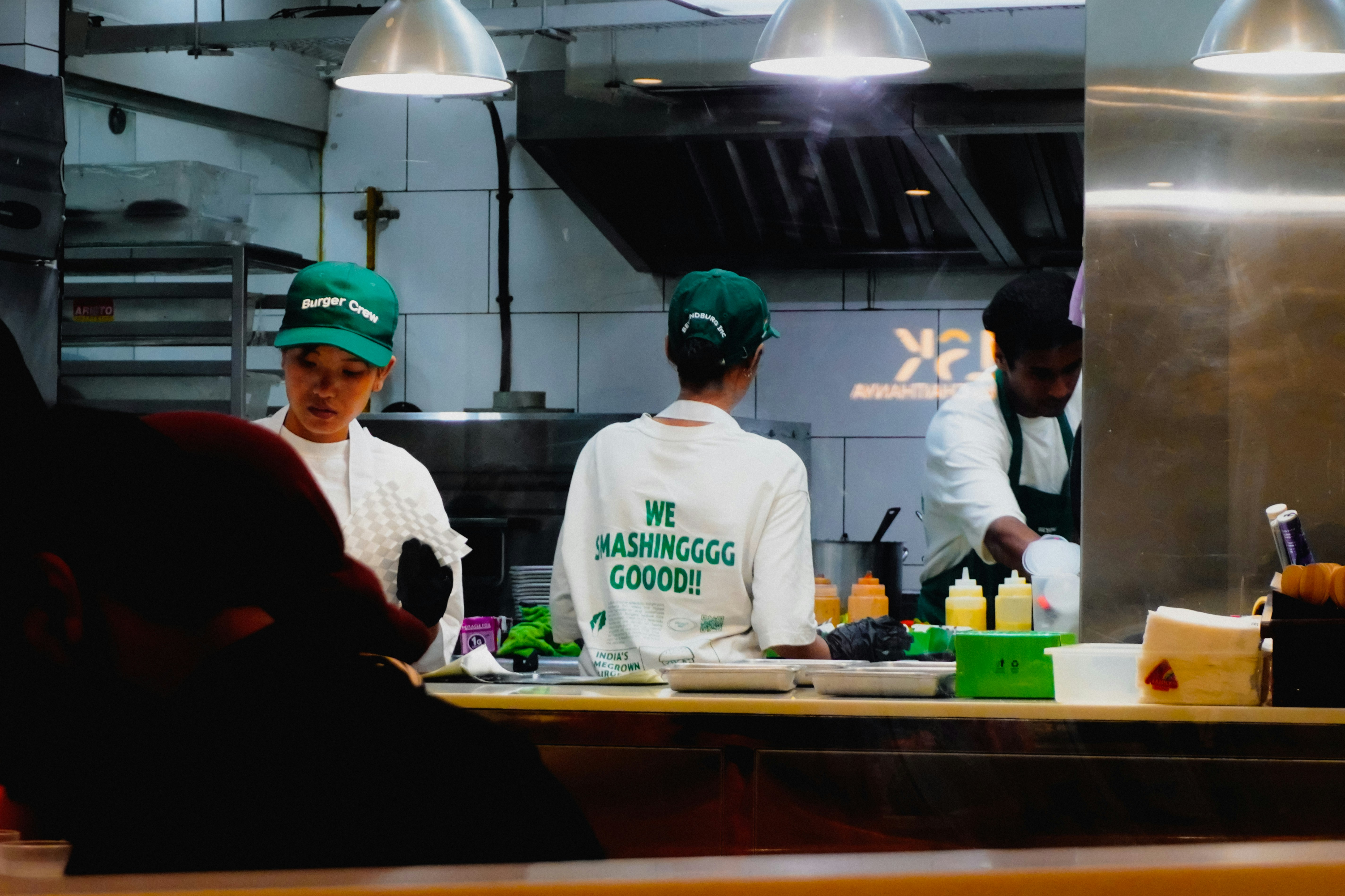 Green-Capped Chef in a Humming Kitchen