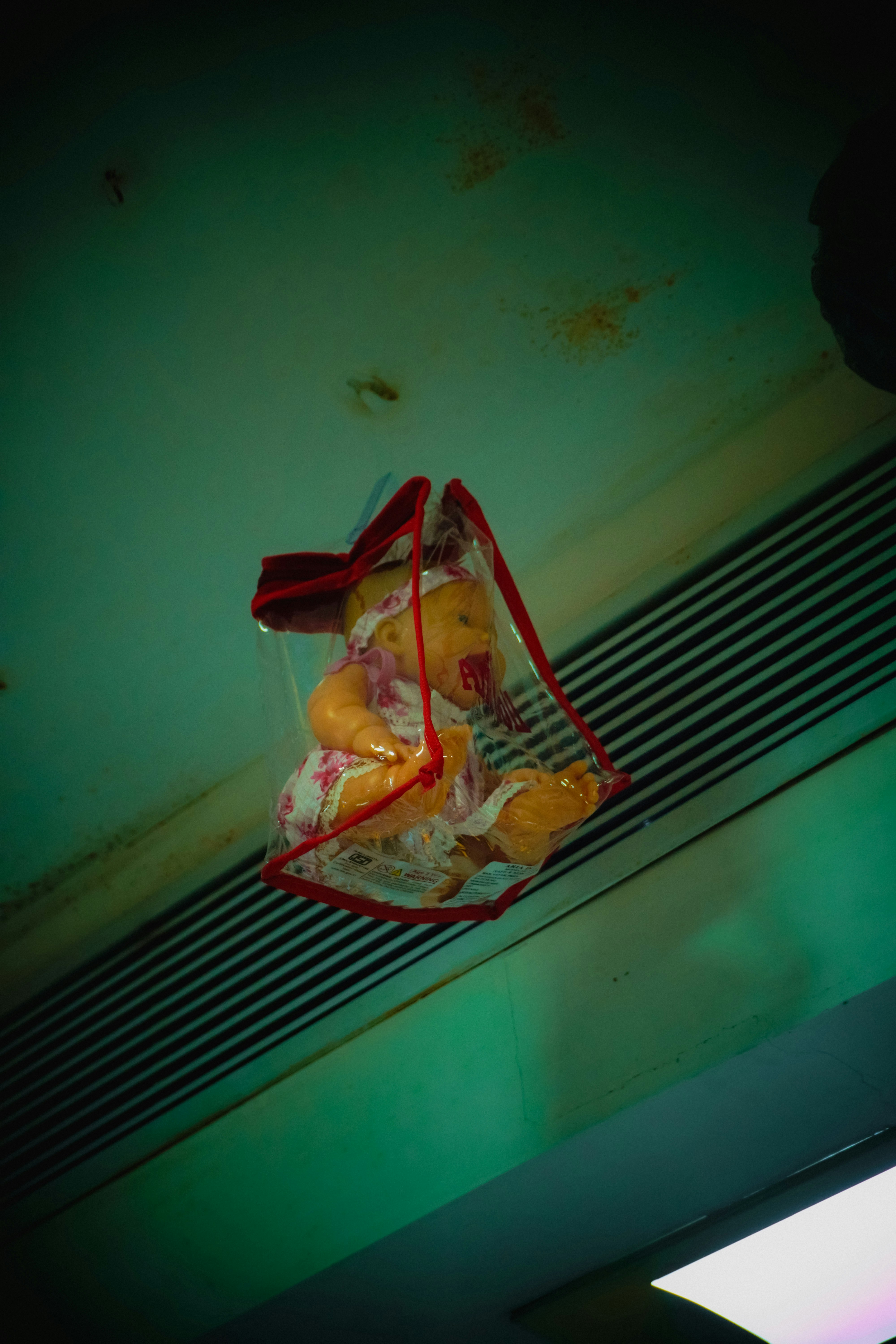 Floating Figurine in a Neon-Sunken Transit