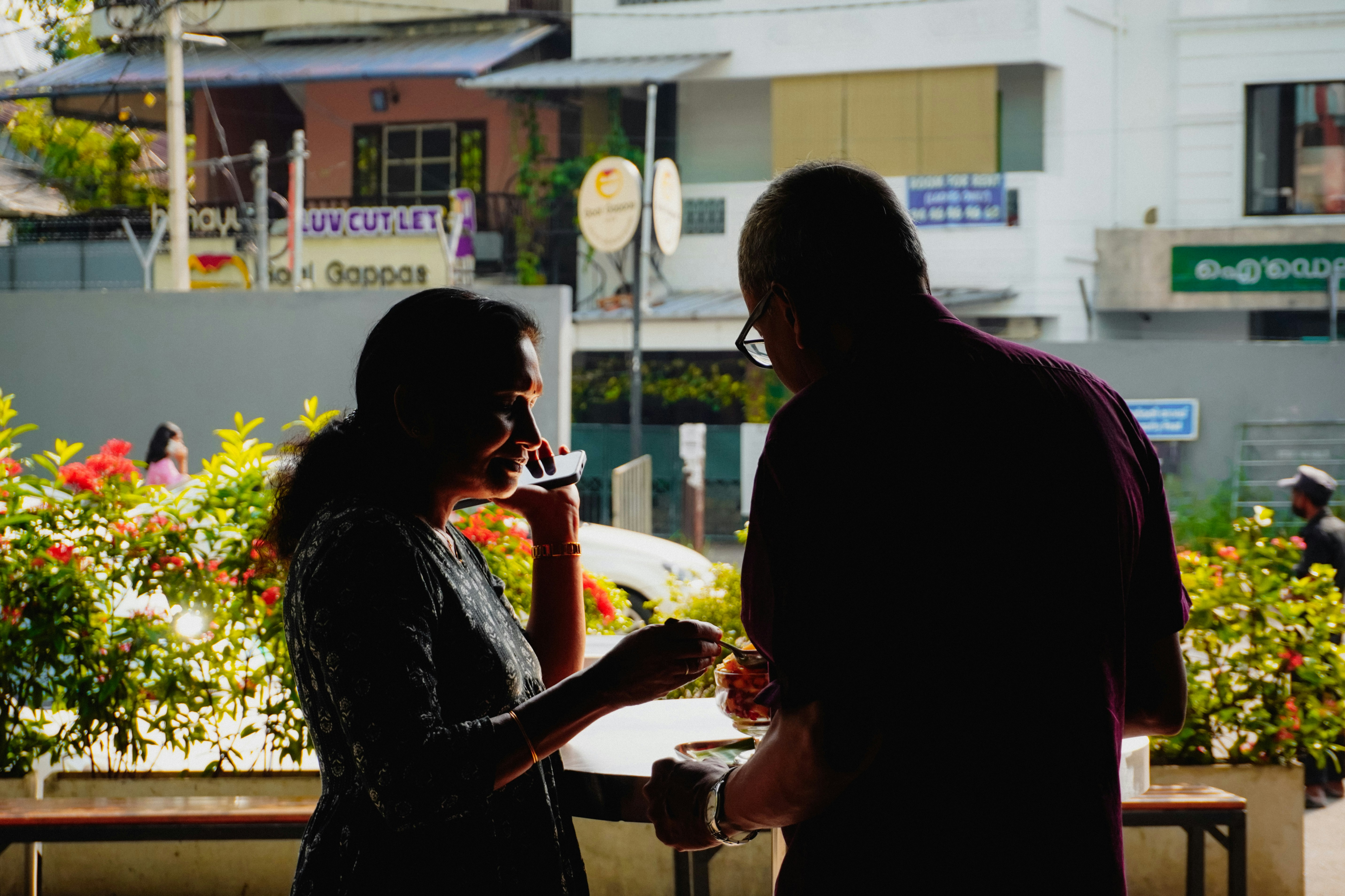 Silhouetted Moment at an Outdoor Café