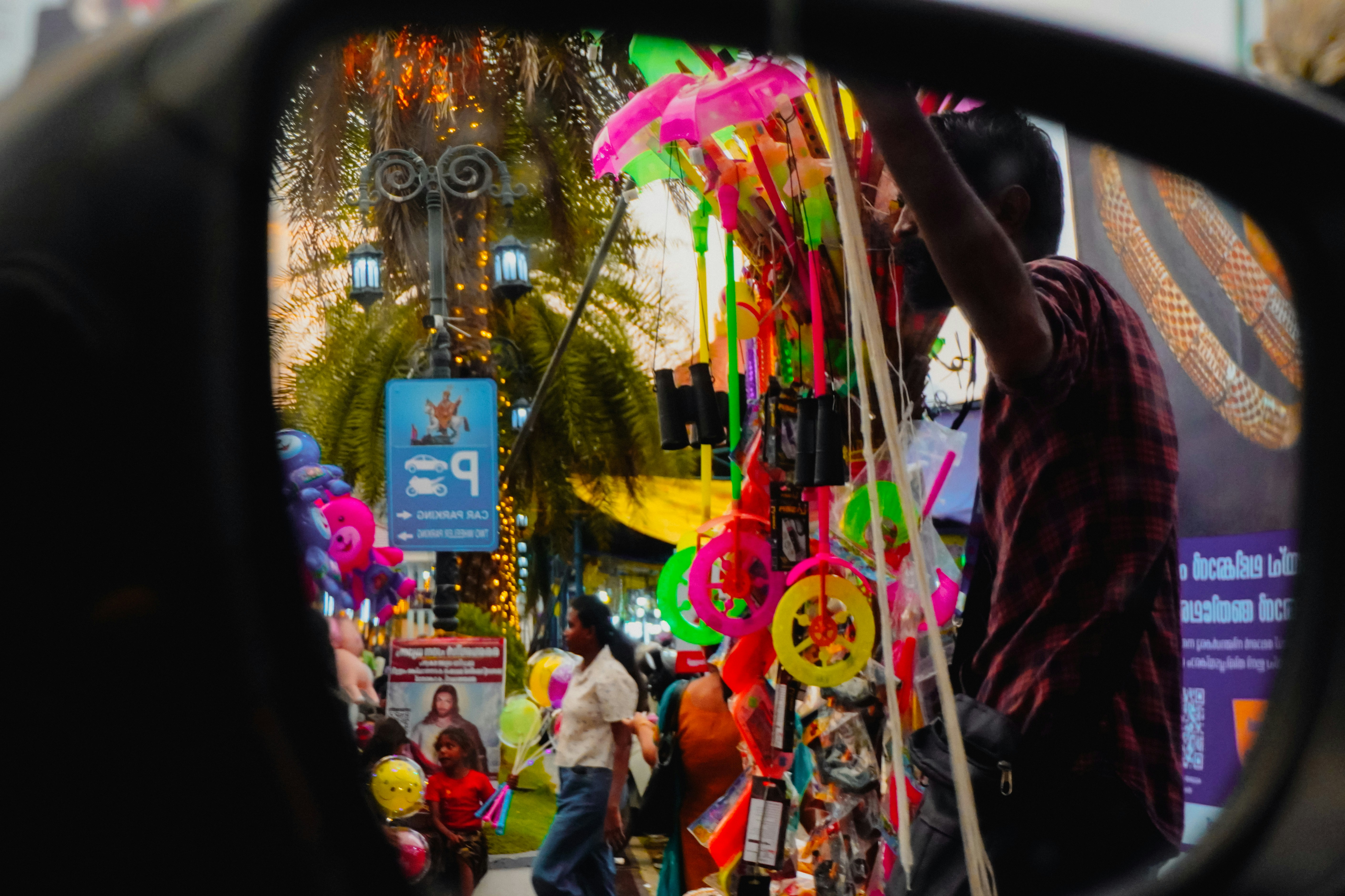 Colorful Carnival Reflections in a Side-View Mirror