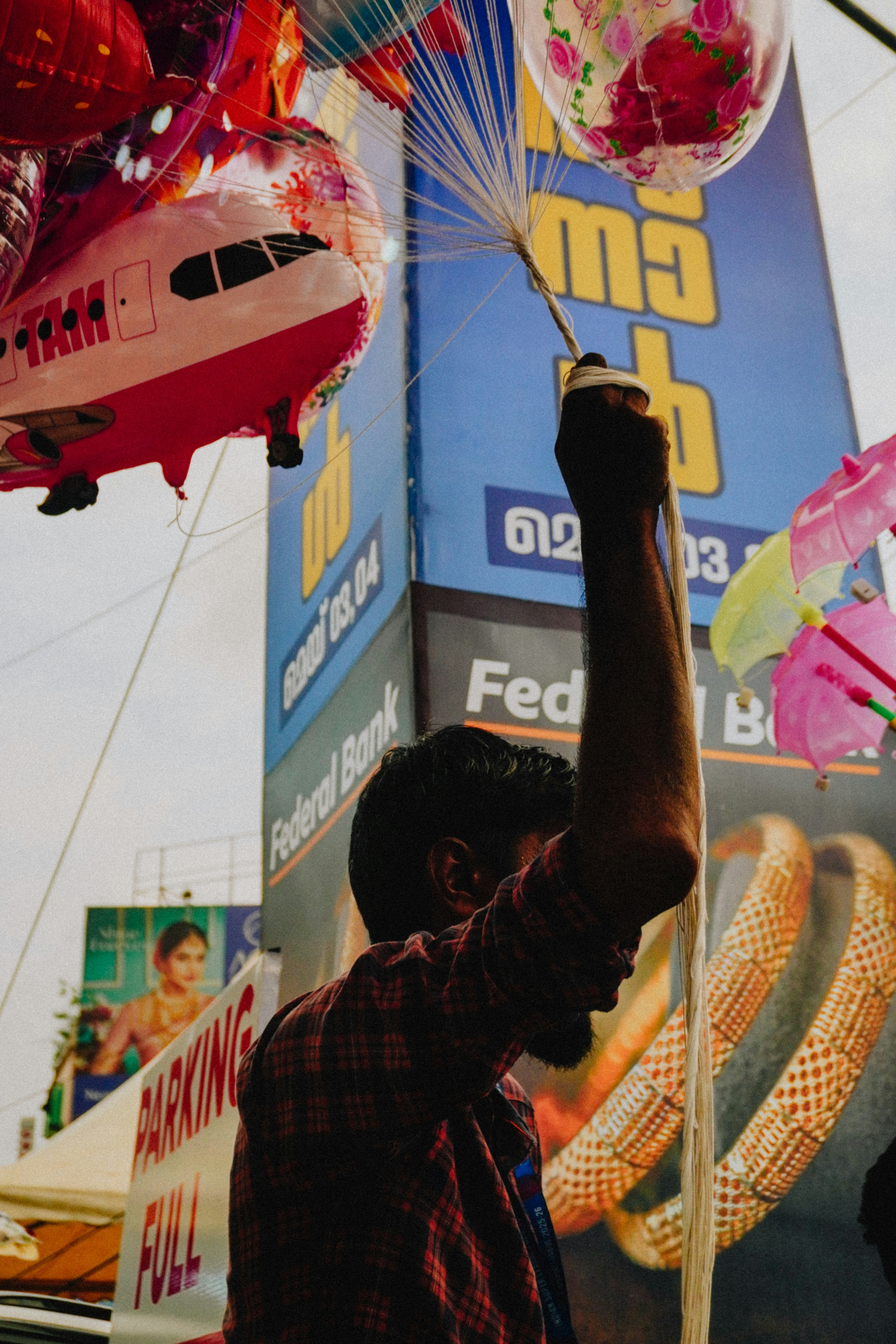 Balloon Bounty: A Rope of Colors and a Bannered Street Scene