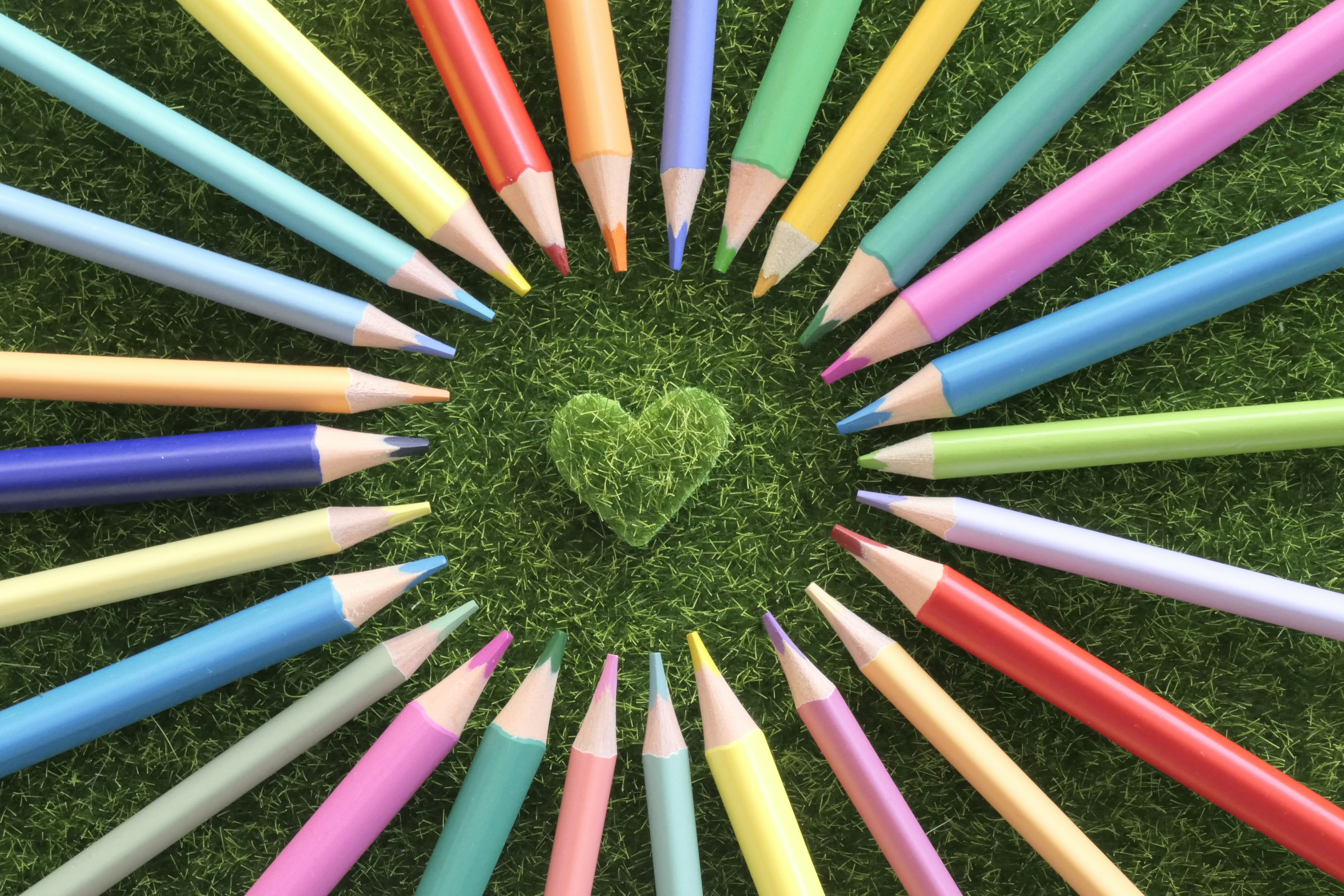 Rainbow Ring of Pencils Encircling a Green Heart