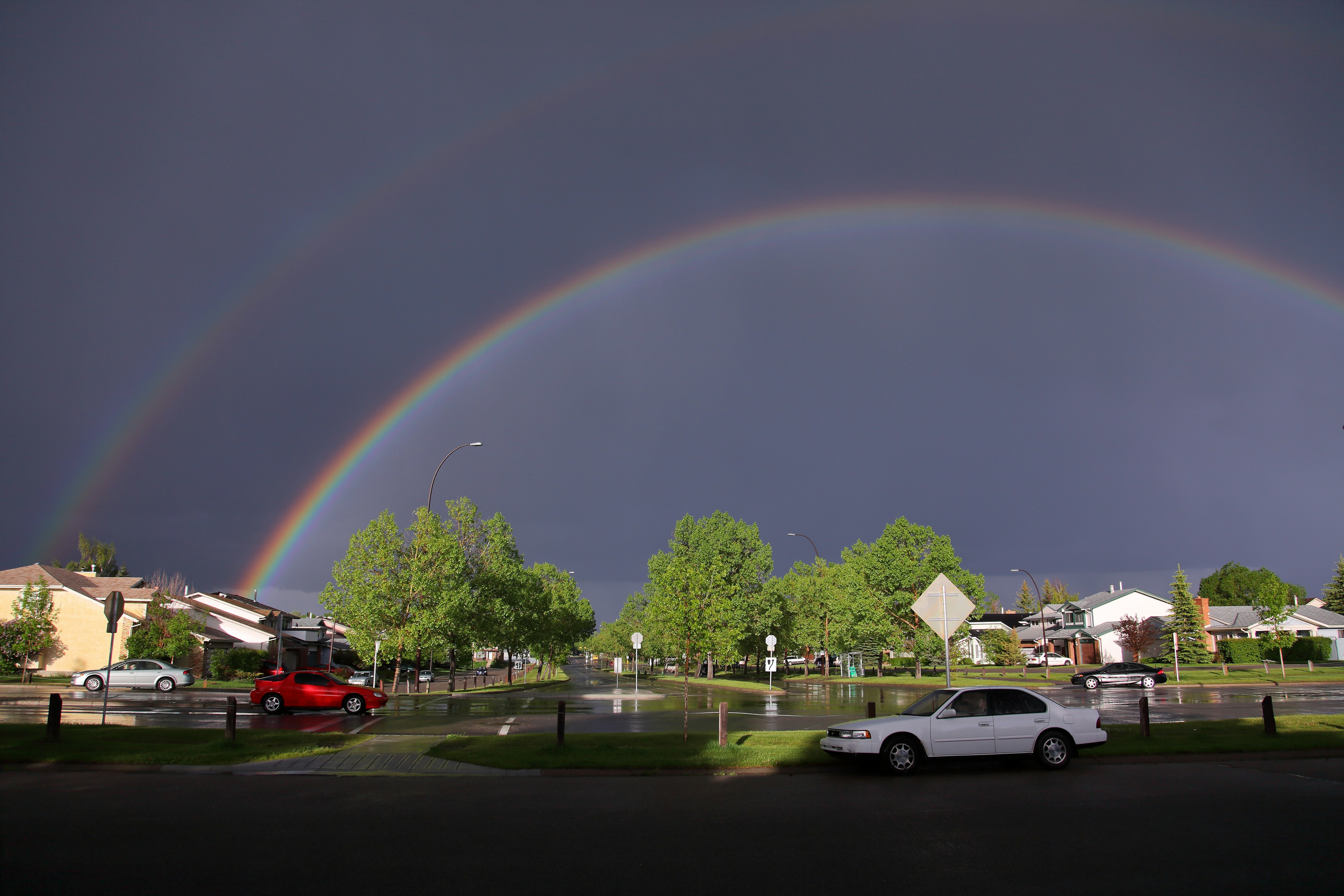 Double Arc: Rainbow Over a Suburban Street