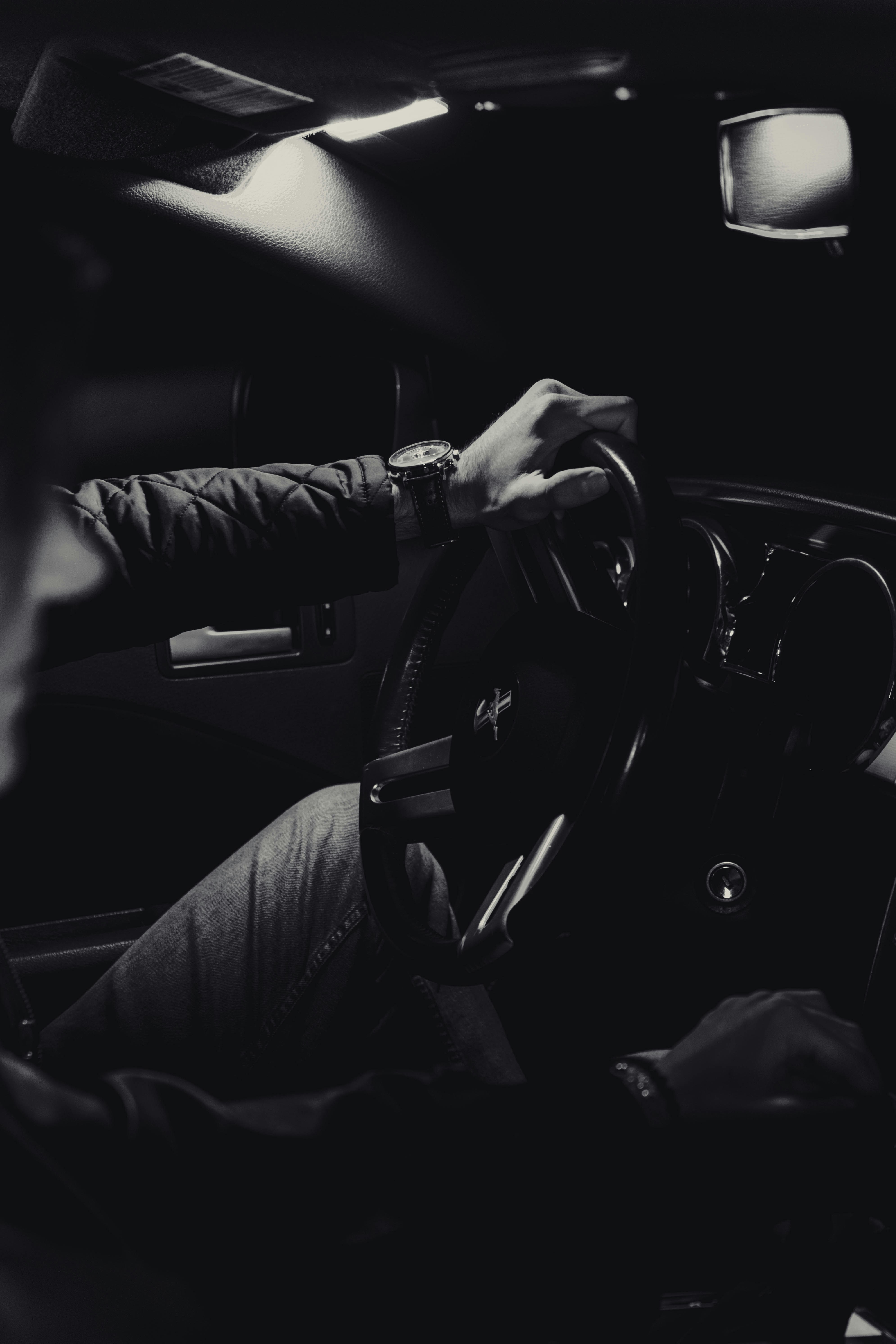 Midnight Drive: Hands on the Wheel in Low Light