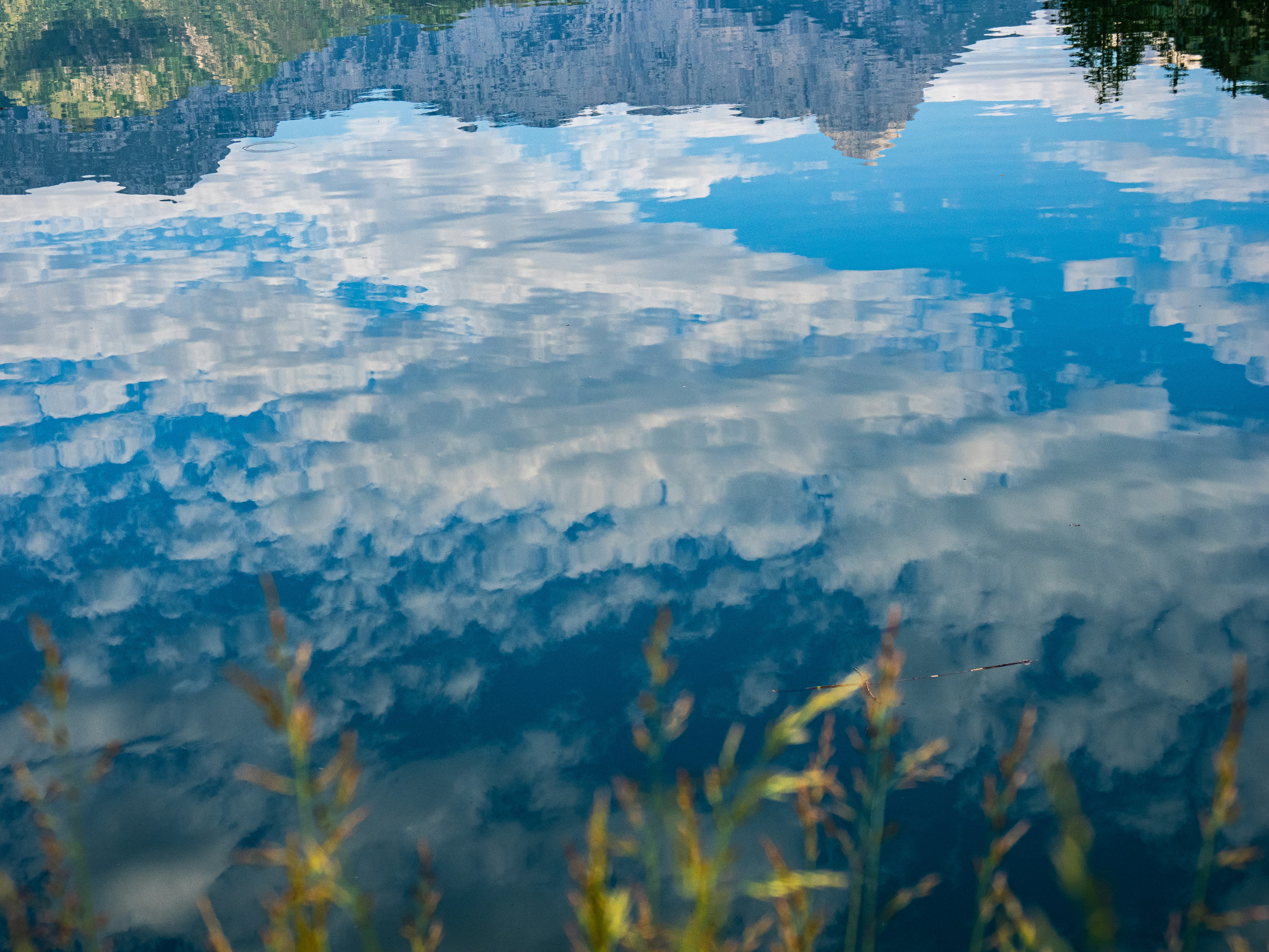 Mirror of the Mountains: A Quiet Lake Refracts the Sky