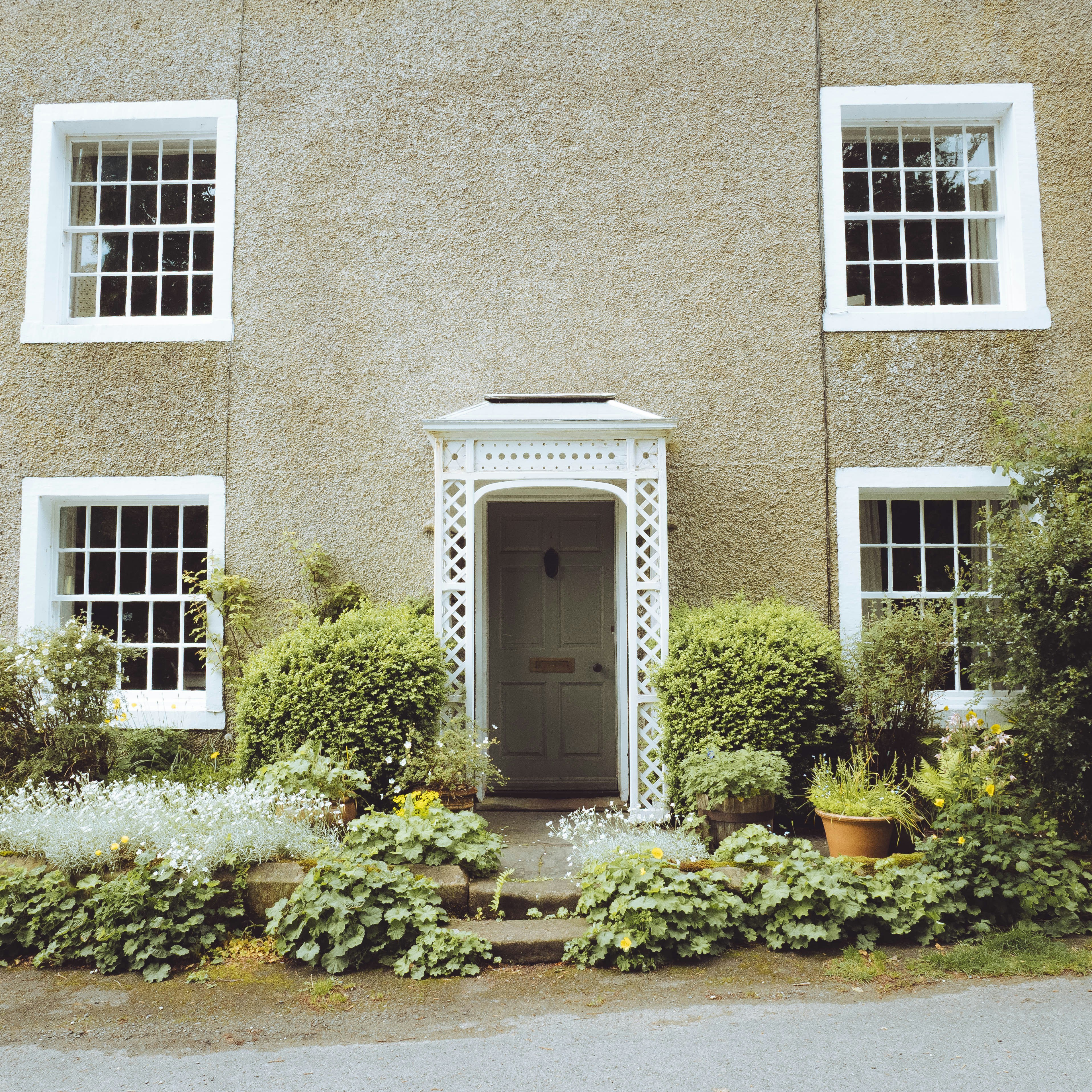 Lilac Cottage Doorway: Garden Border in Full Bloom