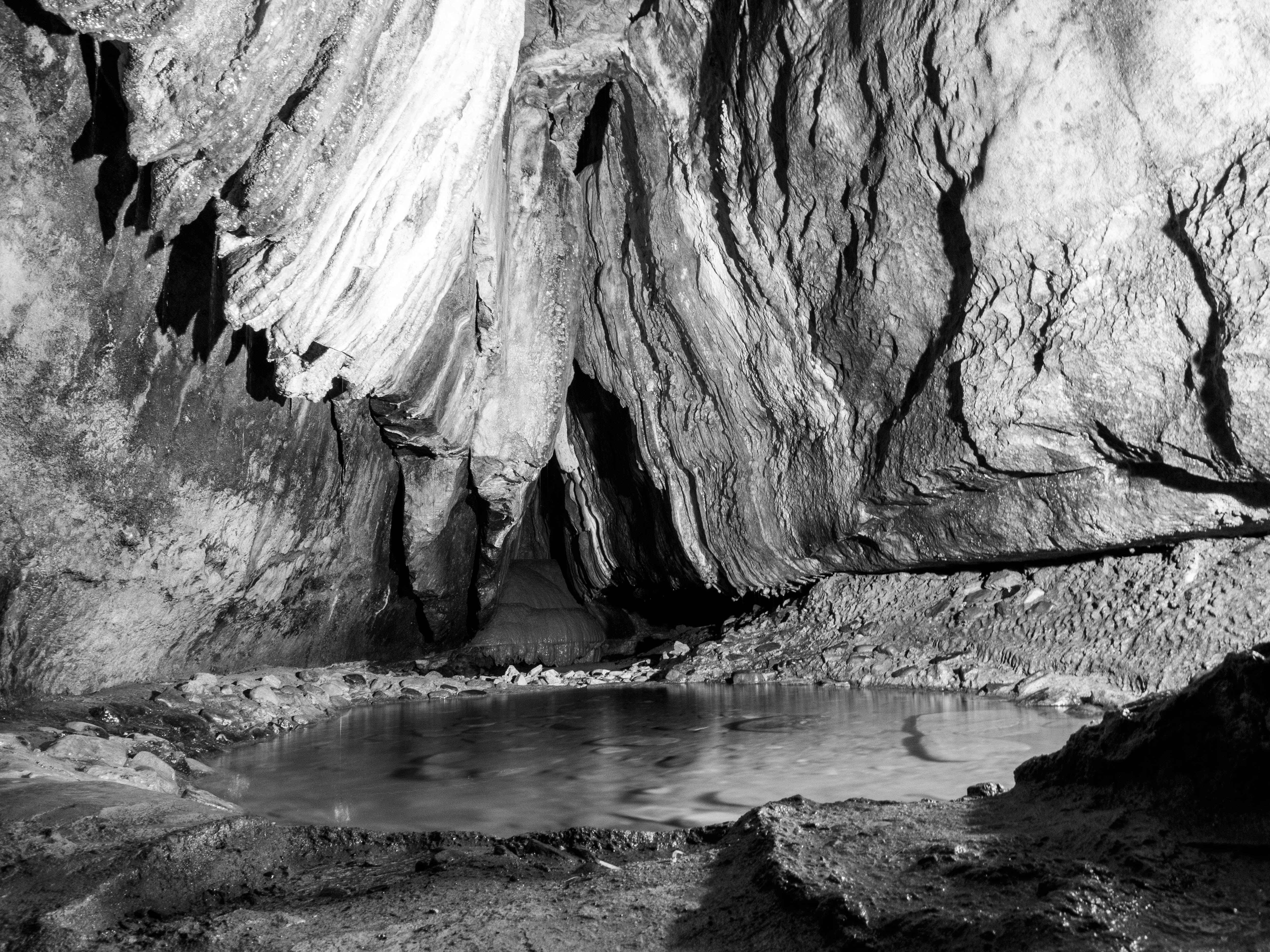 Echoes of Stone: A Quiet Moonlit Pool in a Cave