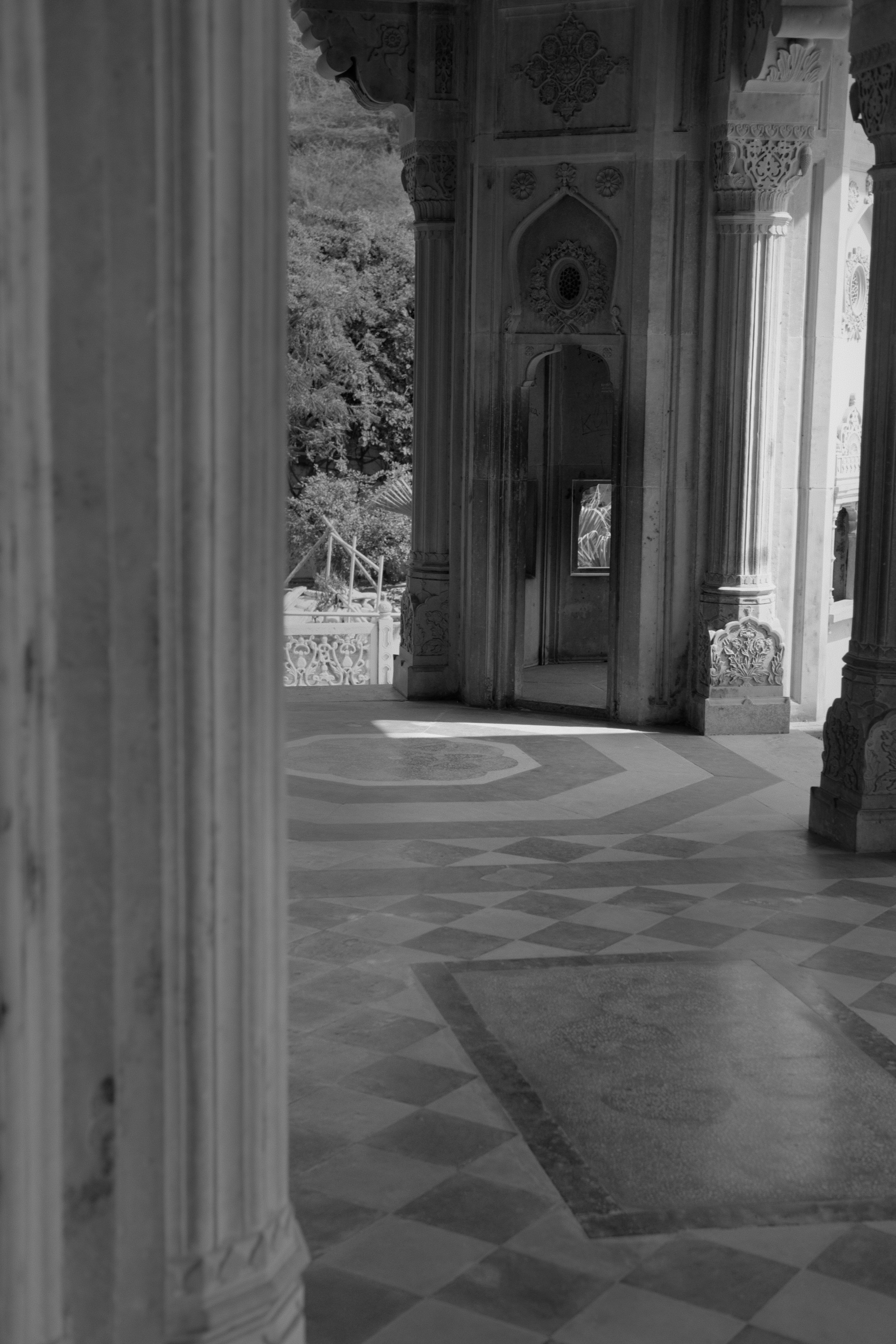 Symmetrical Archway Gallery: Light and Shadow in Marble Hall