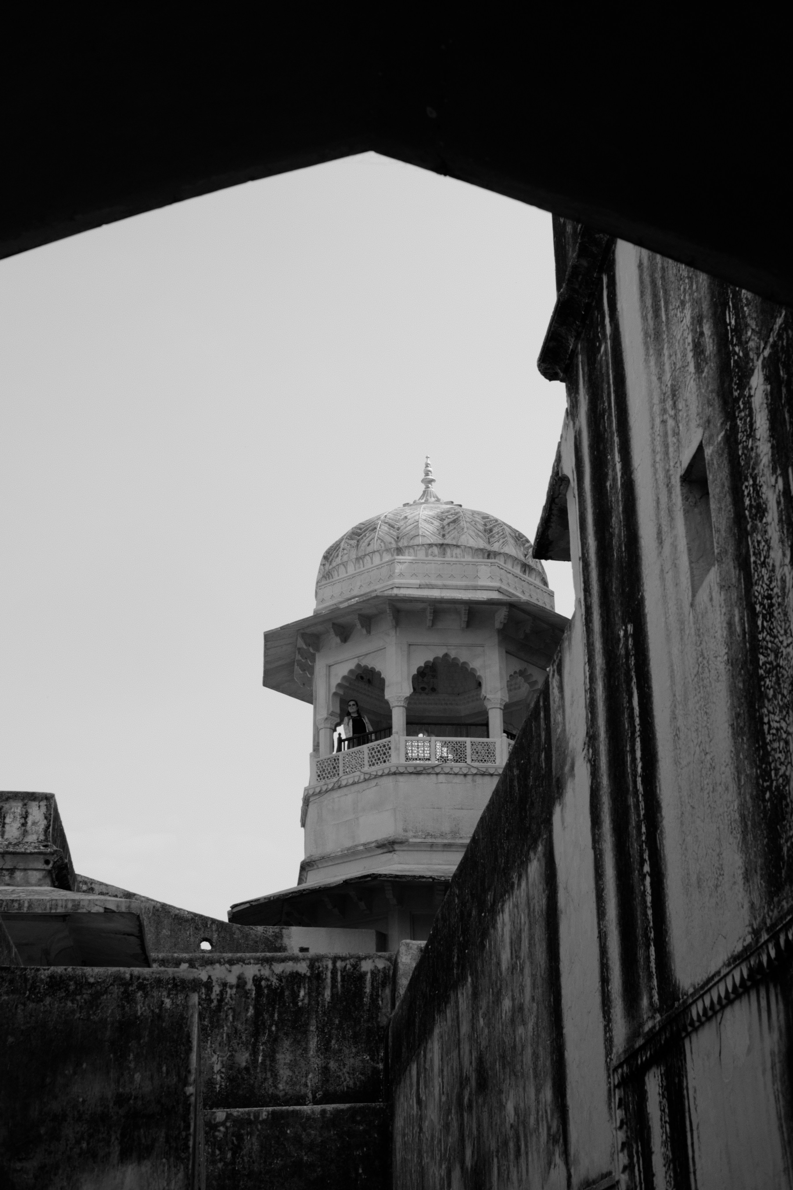 Dome Overlook: A Quiet Tower Framed by shadowed Archways