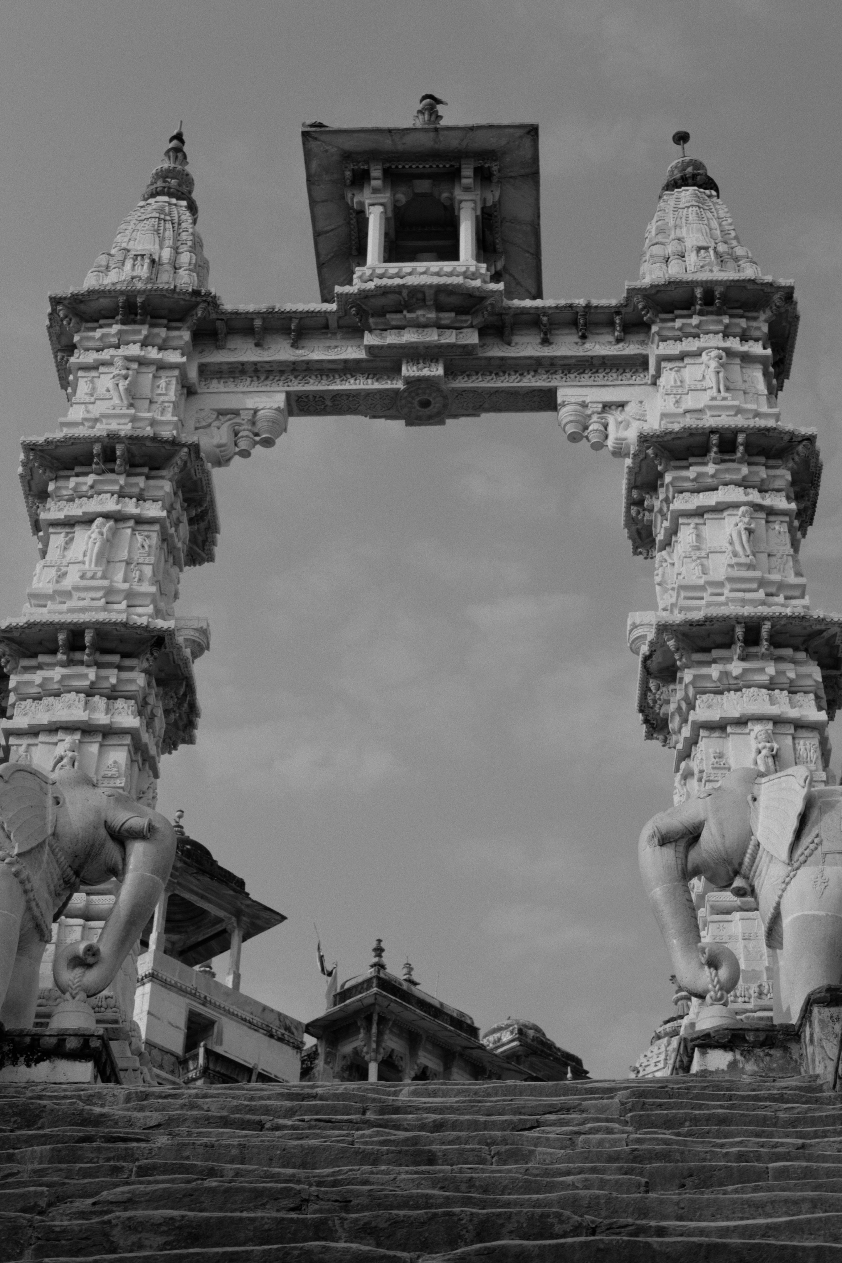 Gate of Stone Carvings: An Archway Framed by Dragons and Staircase