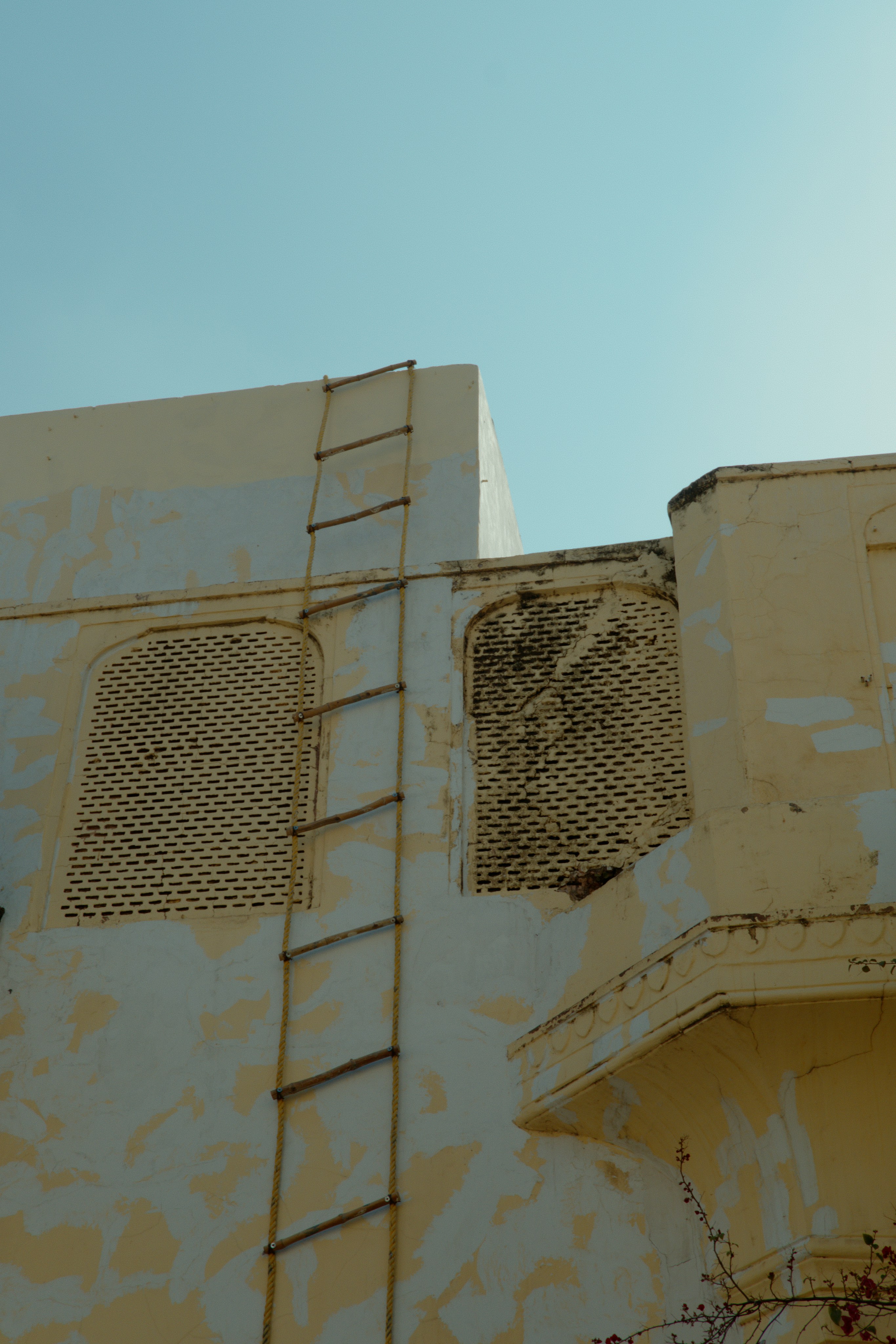 Weathered Ventilation Facade Under a Clear Sky