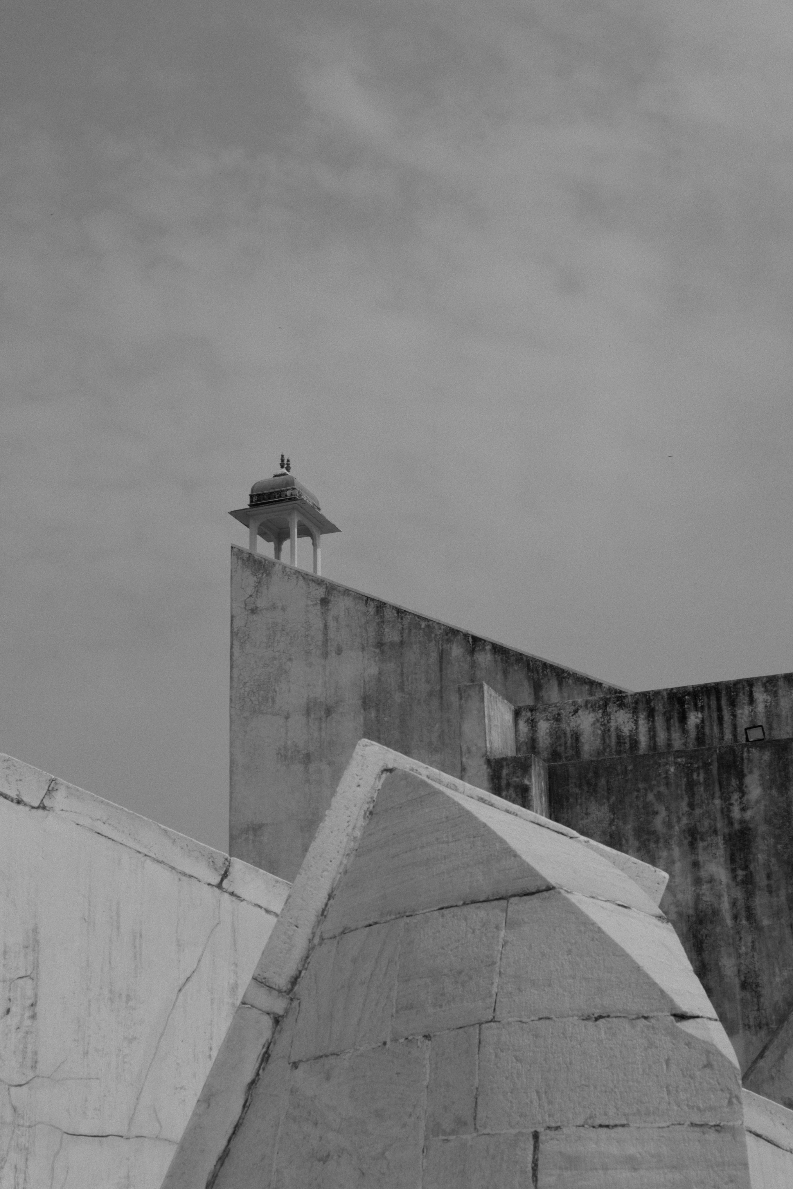 Rooftop Lantern on a Weathered Concrete Silhouette