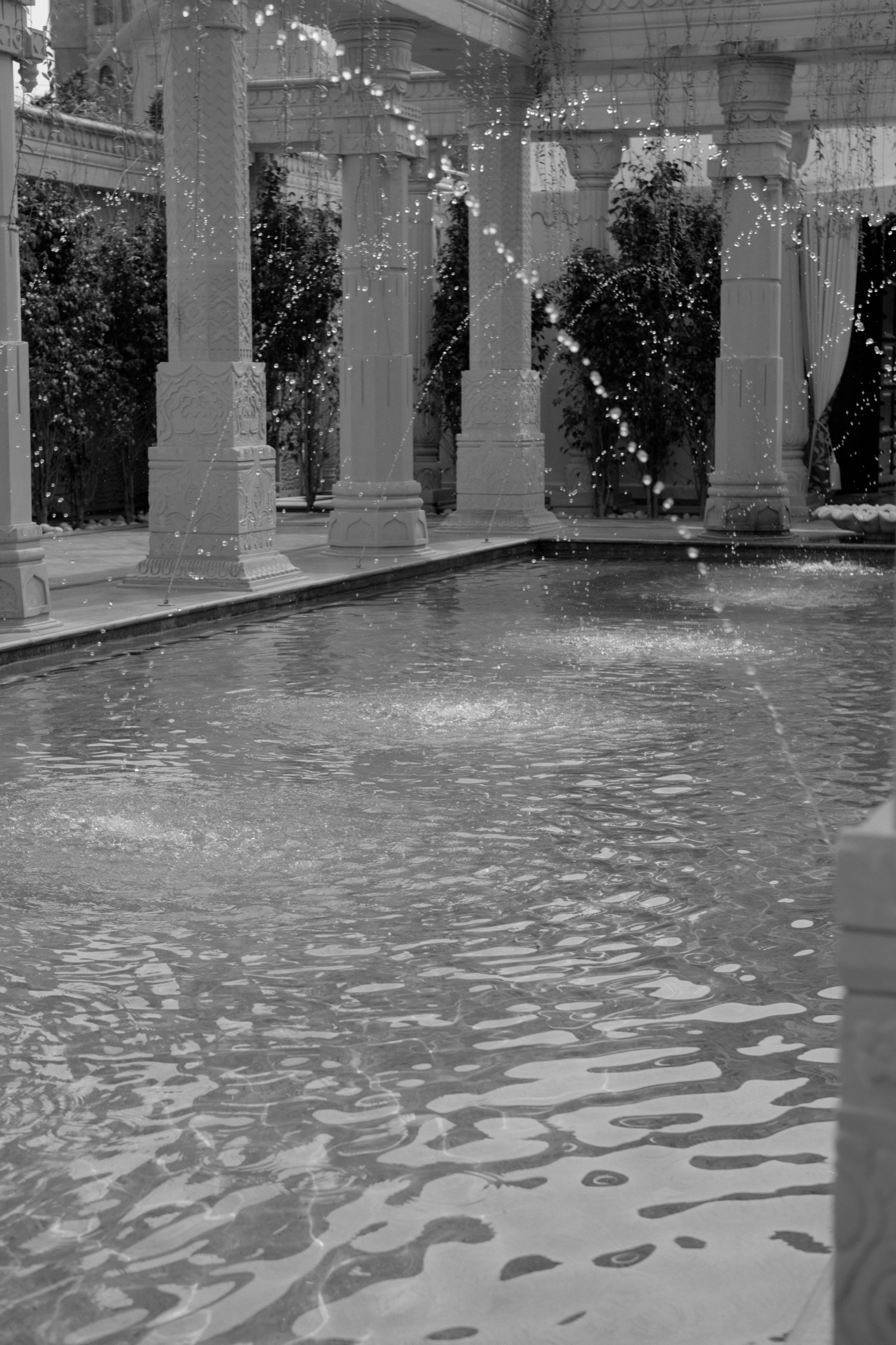 Water and Stone: Quiet Arcade with Falling Light